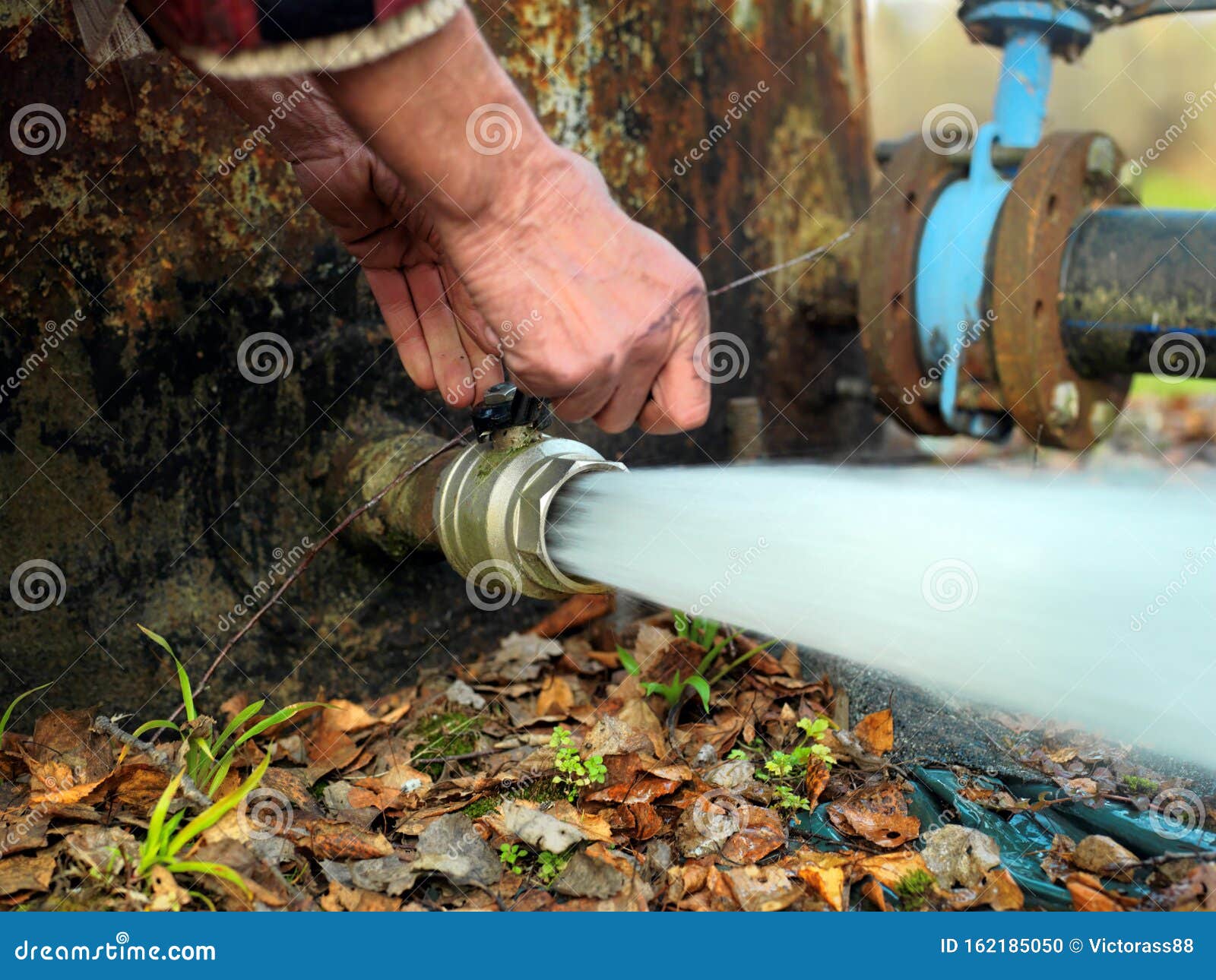 Hands Opening or Closing a Valve Stock Photo - Image of open, drainage ...