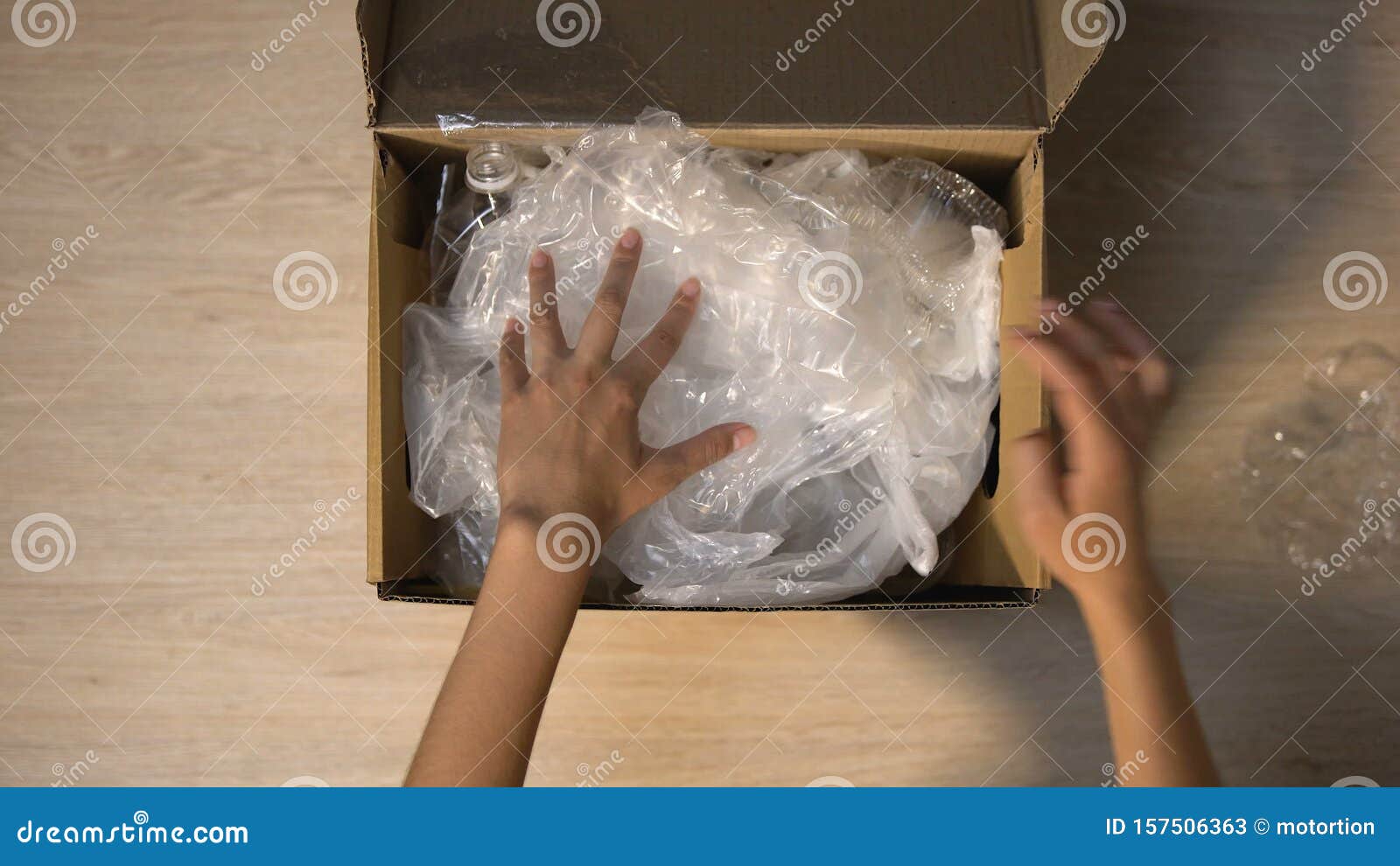 Hands Packing Plastic Waste in Box for Utilizing, Saving Planet from ...