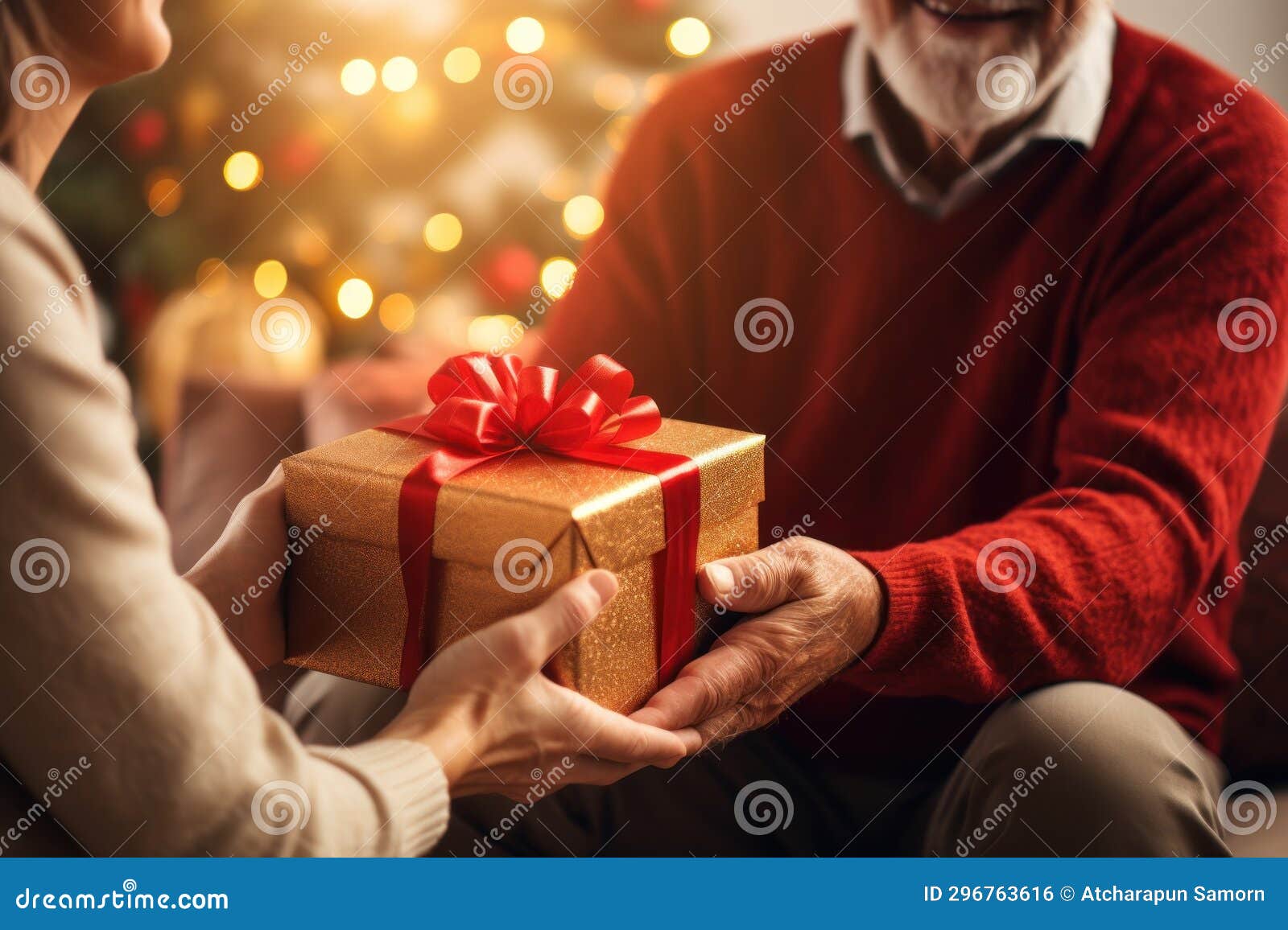 Hands of Parent Giving Christmas Gift on Christmas Tree Background ...