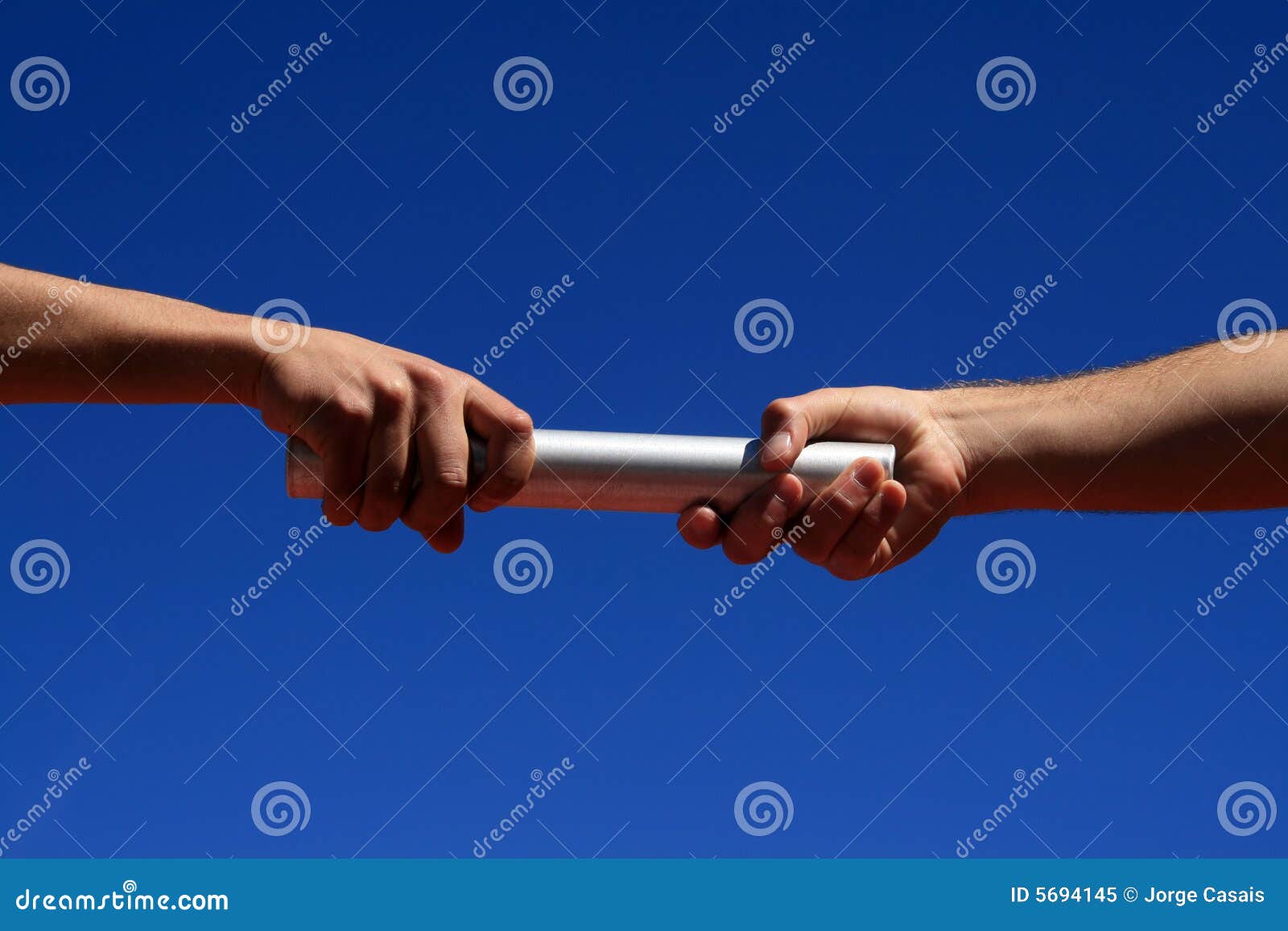 Hands passing the batton stock image. Image of giving - 5694145