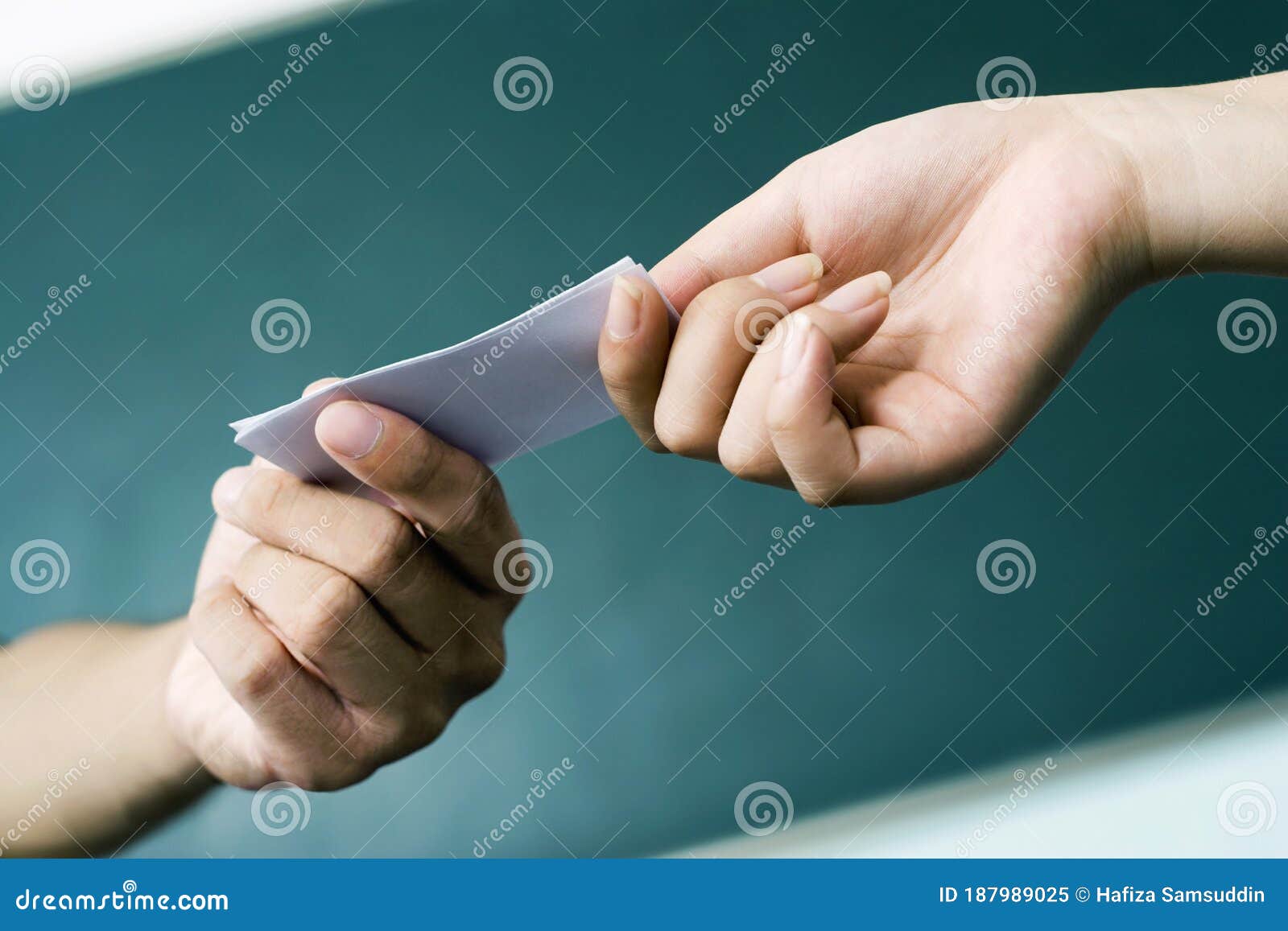 Hands passing a note stock image. Image of learning - 187989025