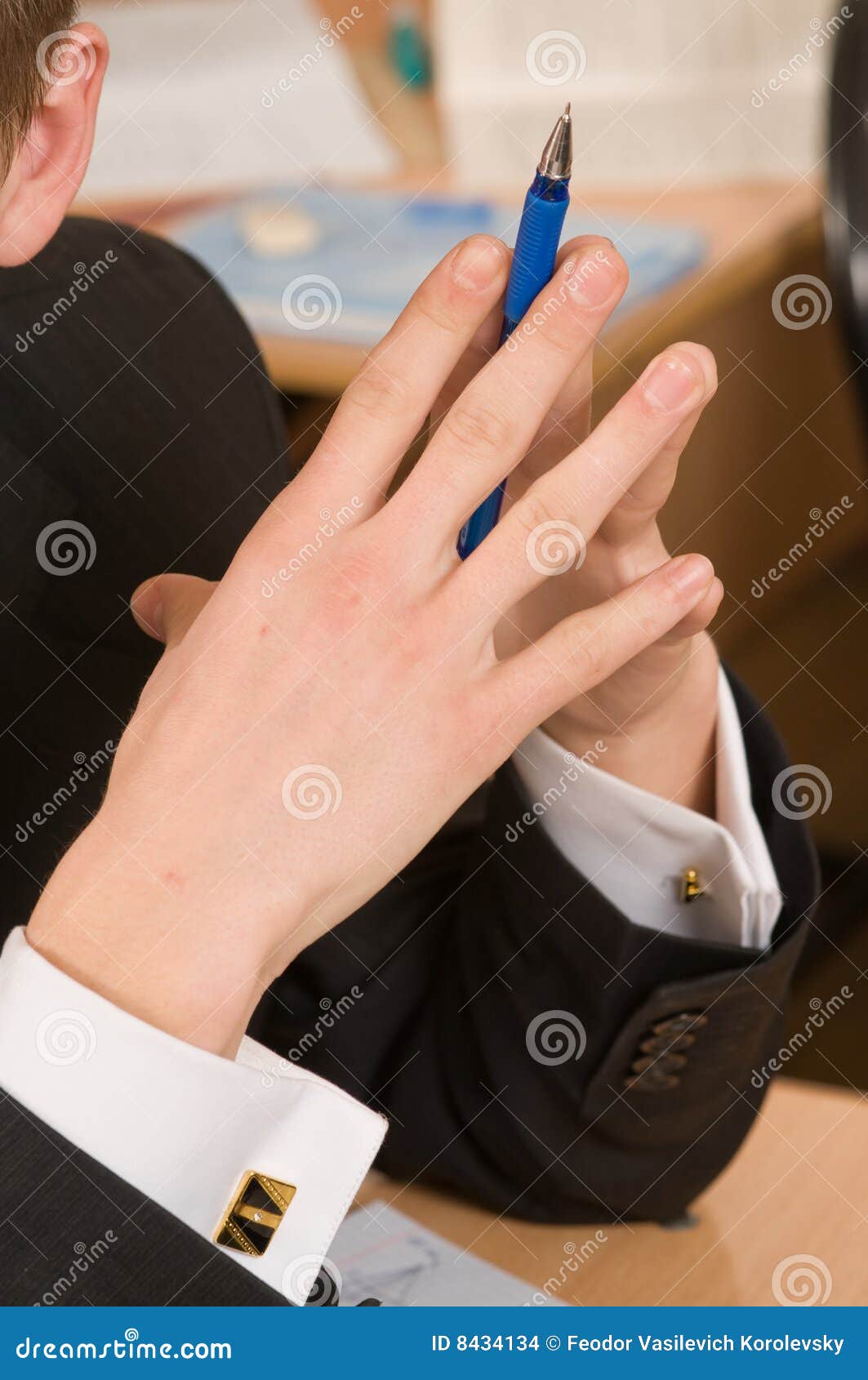 Hands and a pen. stock photo. Image of writing, golden - 8434134