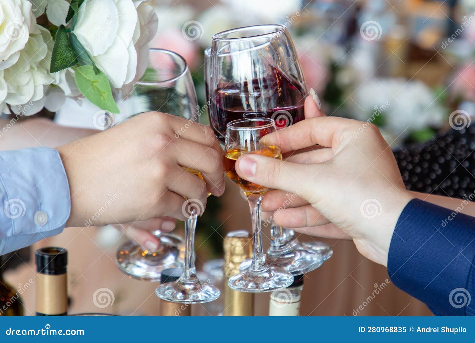 Hands of People Clinking Glasses with Red and White Wine in Restaurant ...