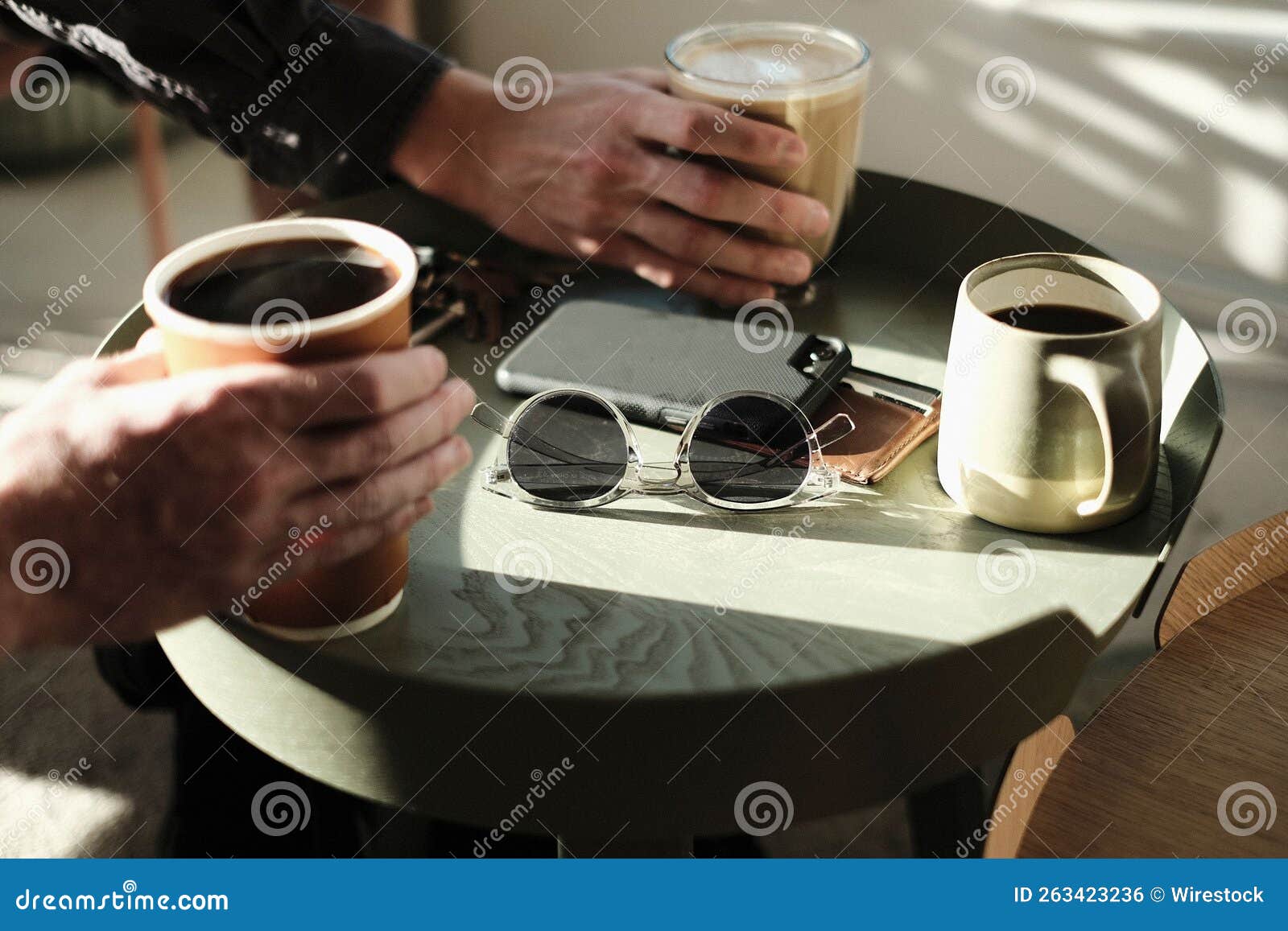 Hands of People Grabbing the Fresh Coffee Cups from the Table in the ...