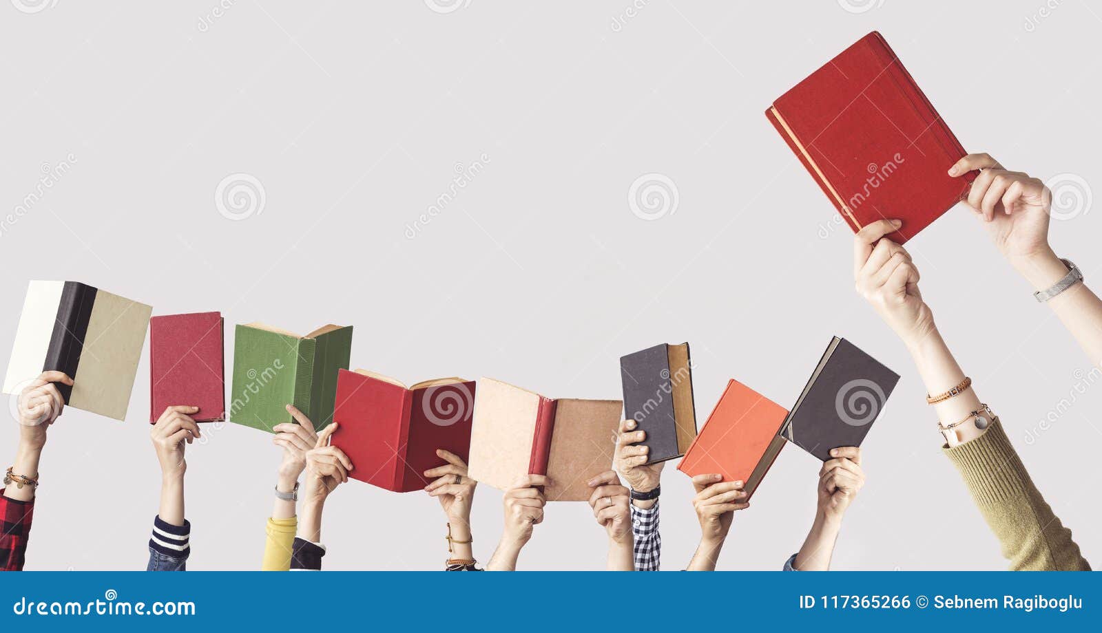 The Hands of People Hold Books Stock Photo - Image of raised, studying ...