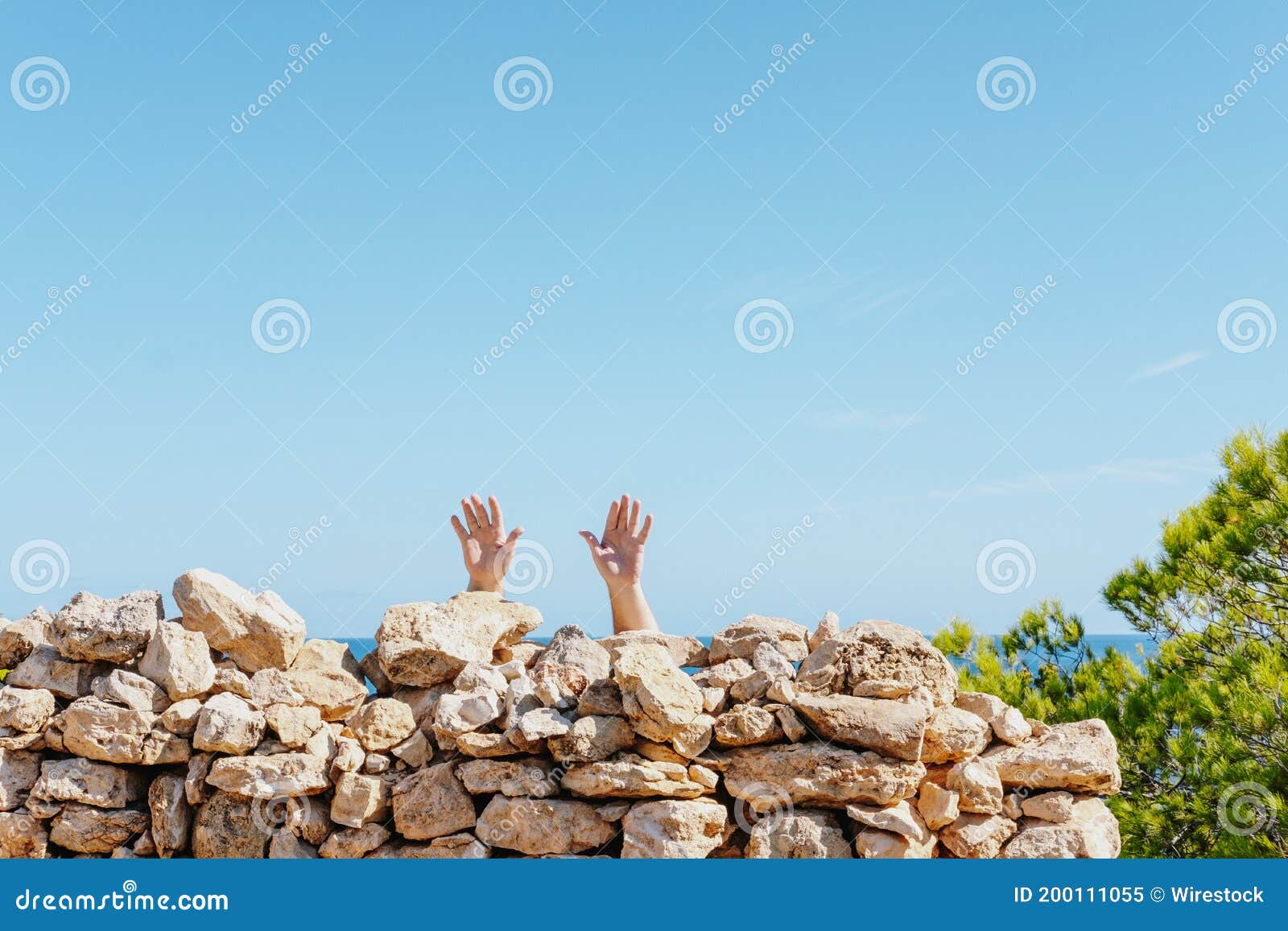 Hands of a Person Behind a Stone Wall - Surrender Concept Stock Image ...