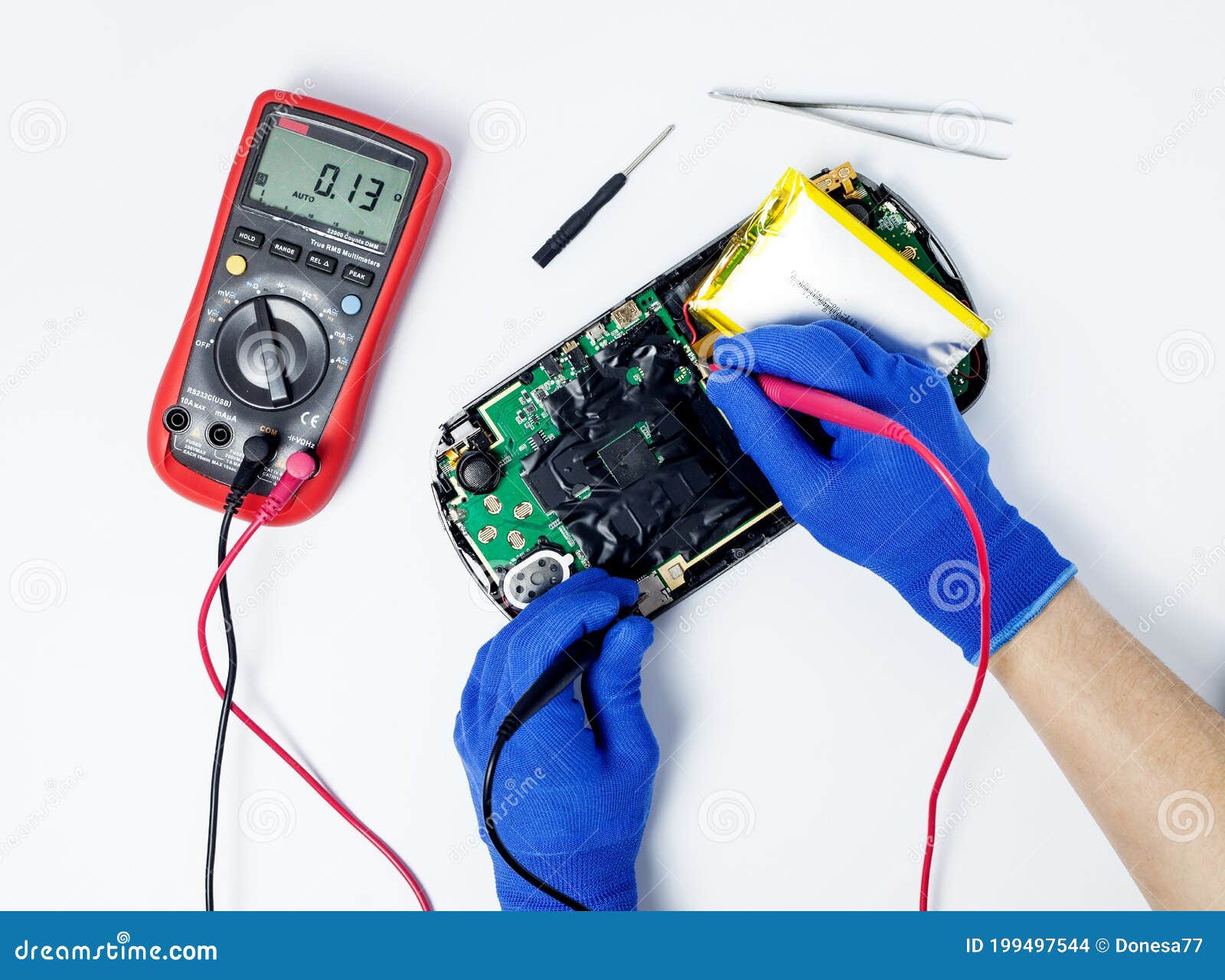 Hands of a Person Performing Diagnostics with a Multimeter of a ...