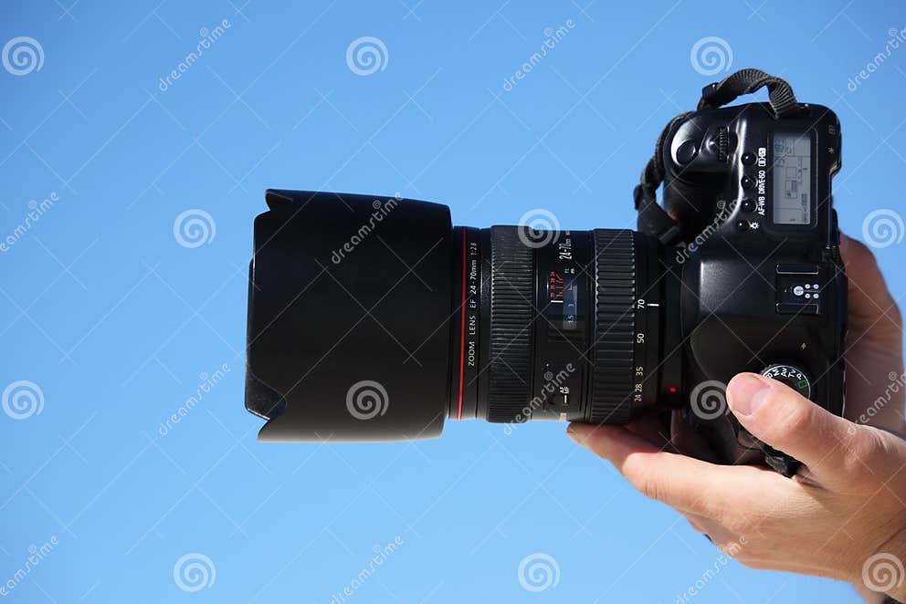 Hands with photo camera stock image. Image of reflex - 10353945