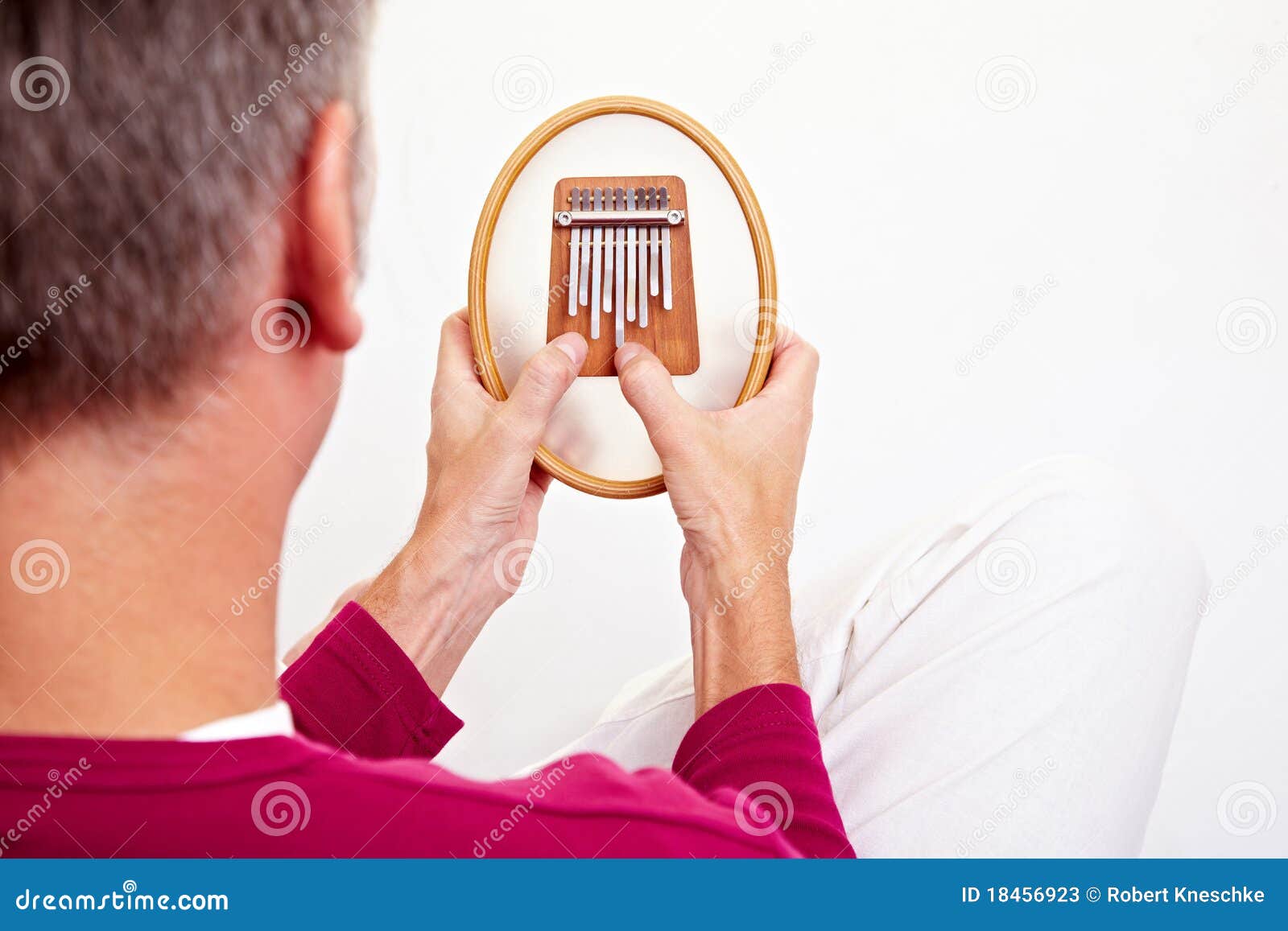 Hands playing a Kalimba stock image. Image of people - 18456923