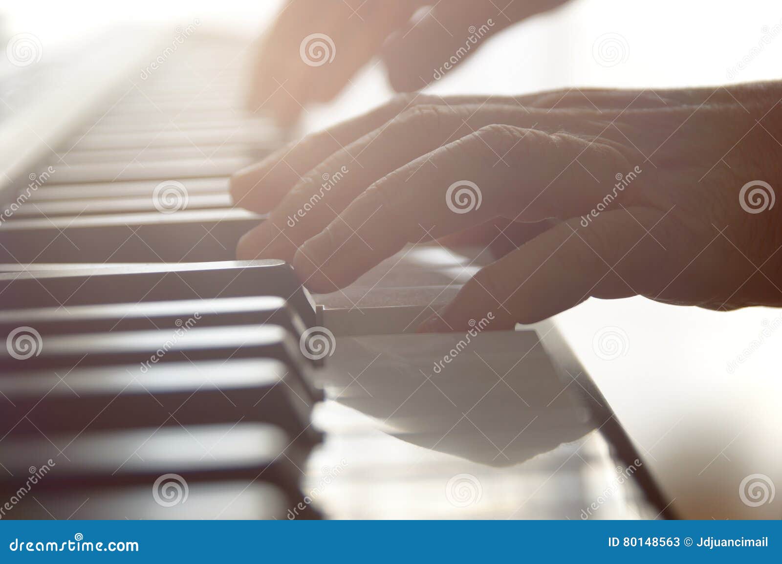 Hands Playing a Piano Against a Sunlight Lighting Stock Image - Image ...