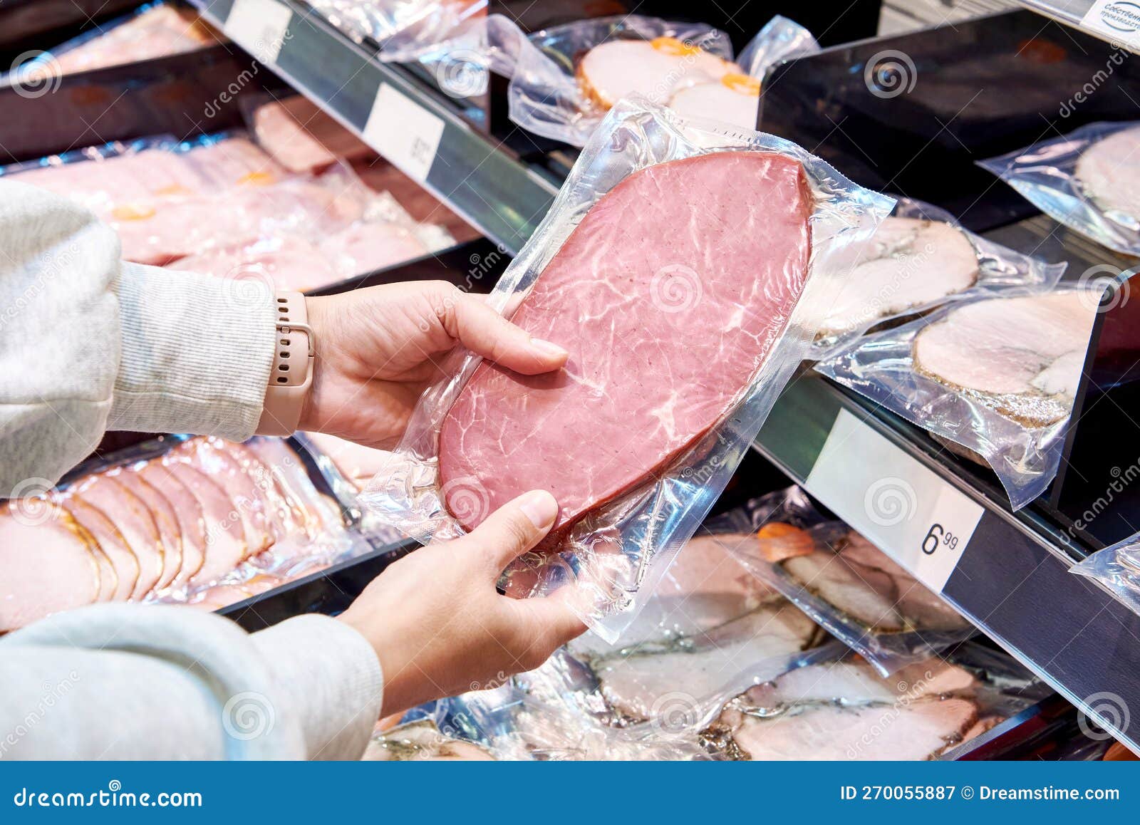 Hands with ham at store stock image. Image of store - 270055887