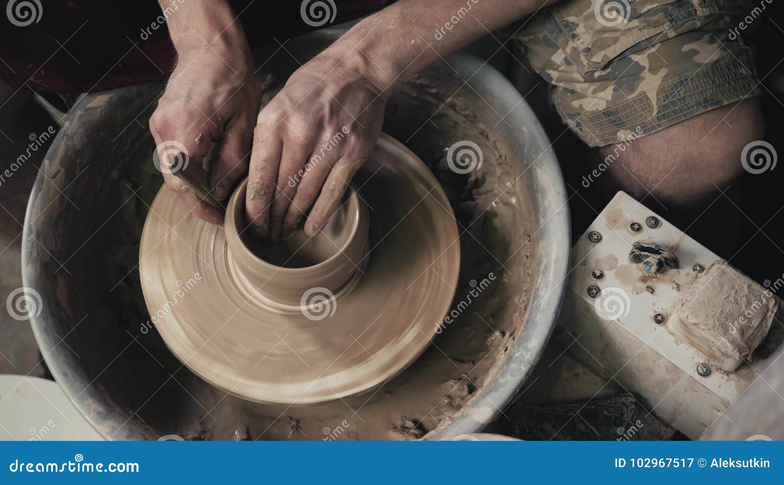 The Hands of a Potter, Creating an Earthen Jar on the Circle, Close-up ...