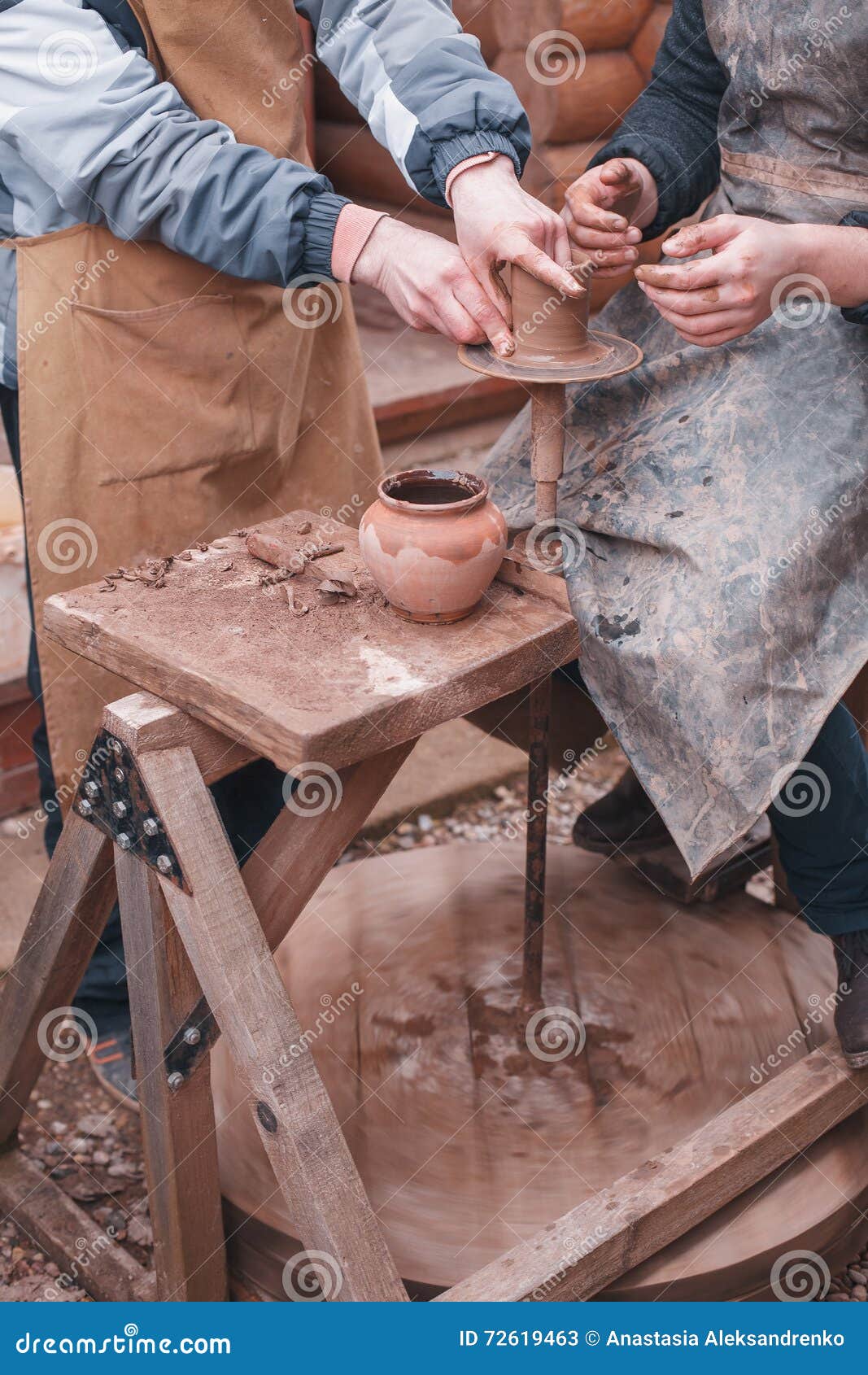 The Hands of Potter Help Make Pitcher on Pottery Wheel Stock Image ...