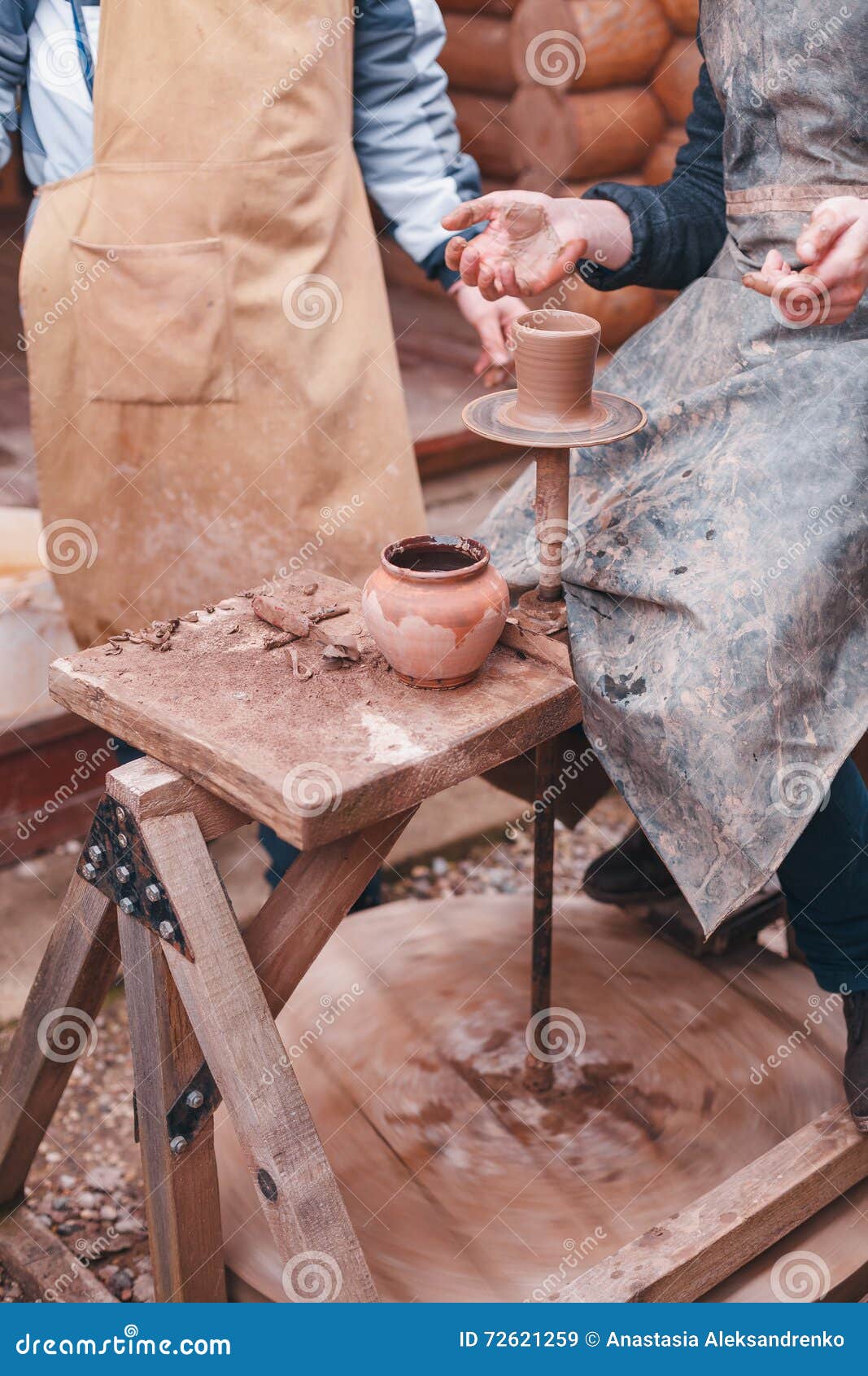 The Hands of Potter Help Make Pitcher on Pottery Wheel Stock Image ...