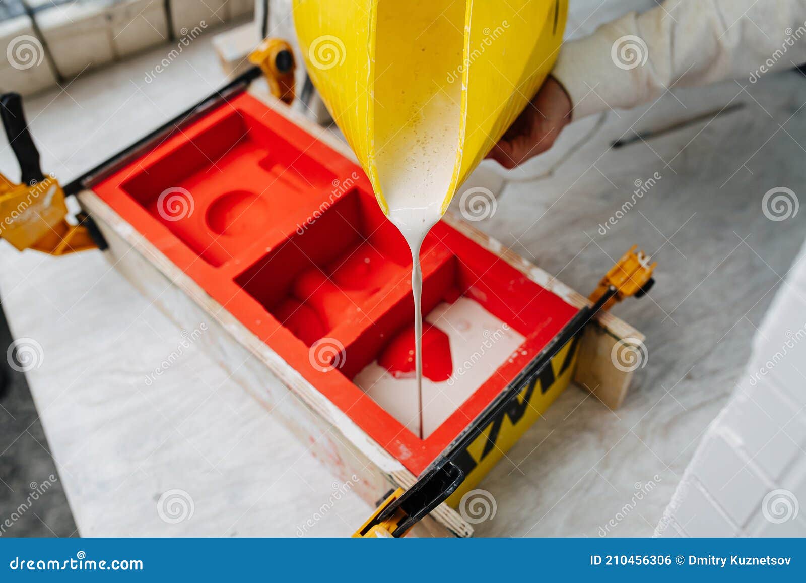 Hands Pouring Gypsum Plaster in Open Form for Mold Casting for Making ...