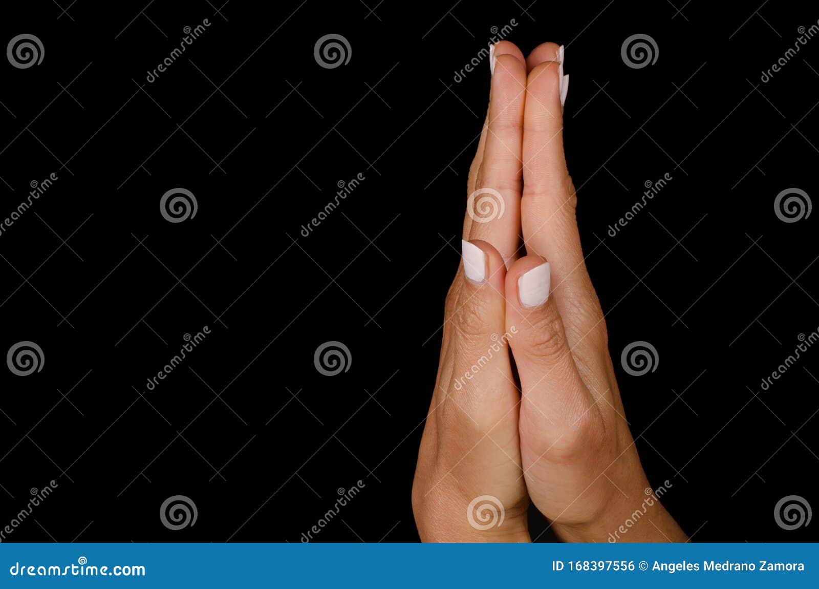 Hands in praying gesture stock photo. Image of copy - 168397556