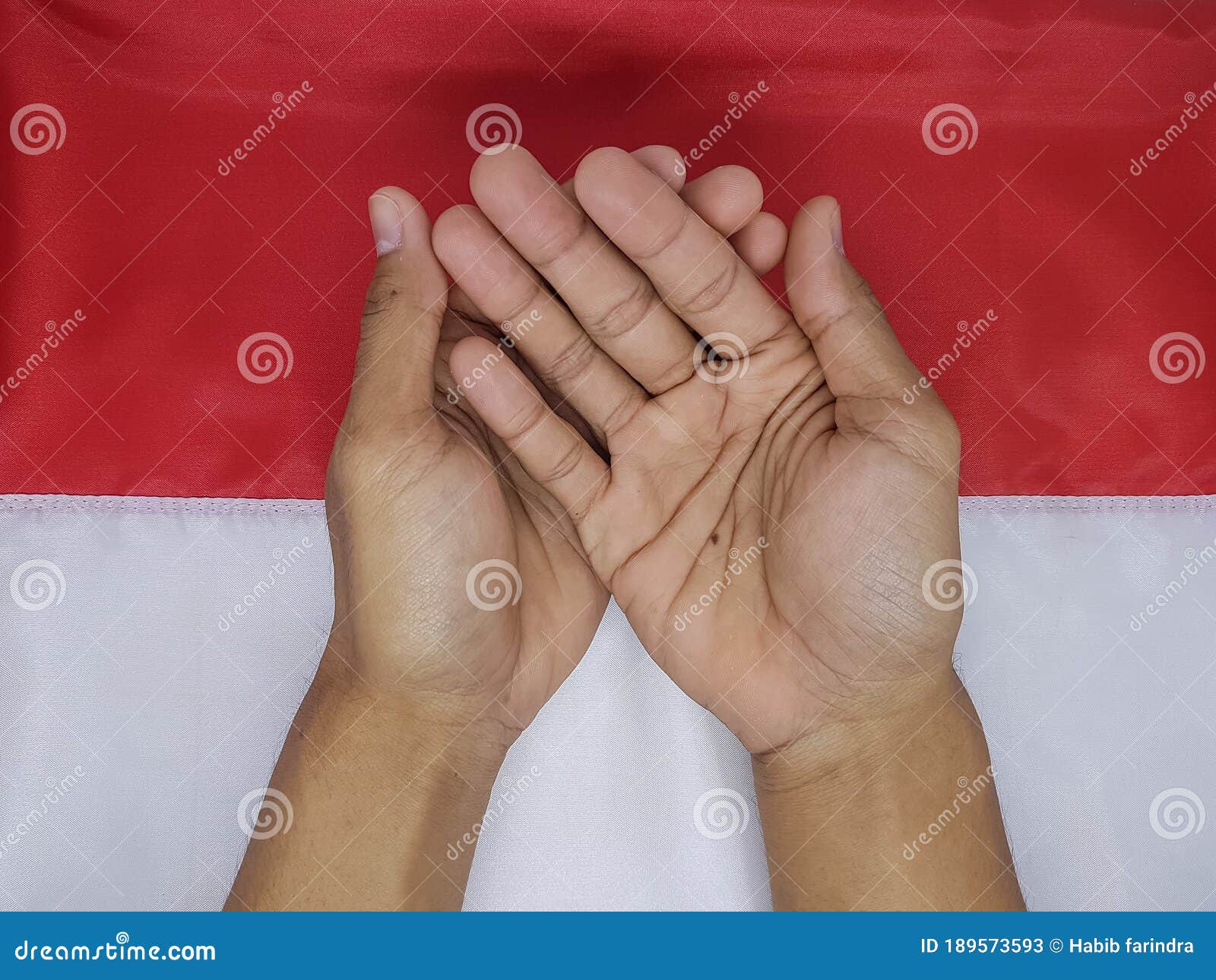 Hands are Praying on the Indonesian Flag Stock Image - Image of ...