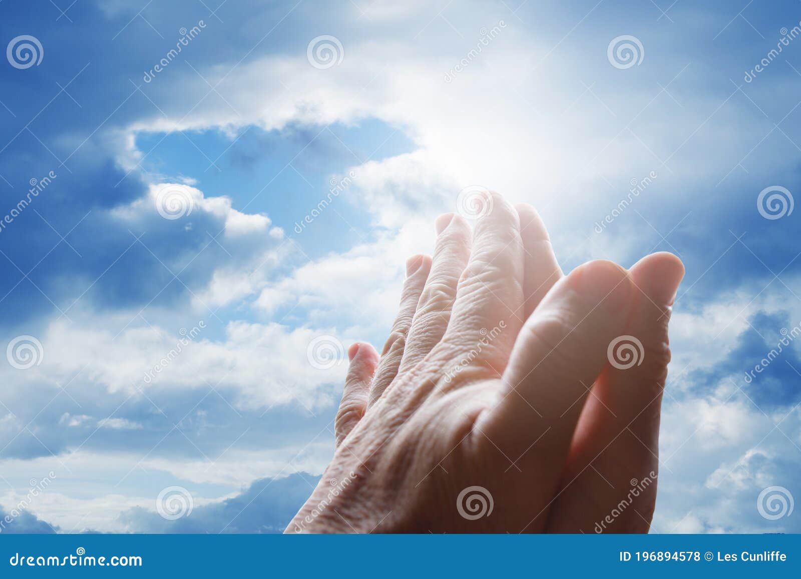 Hands praying and sky stock photo. Image of symbolic - 196894578