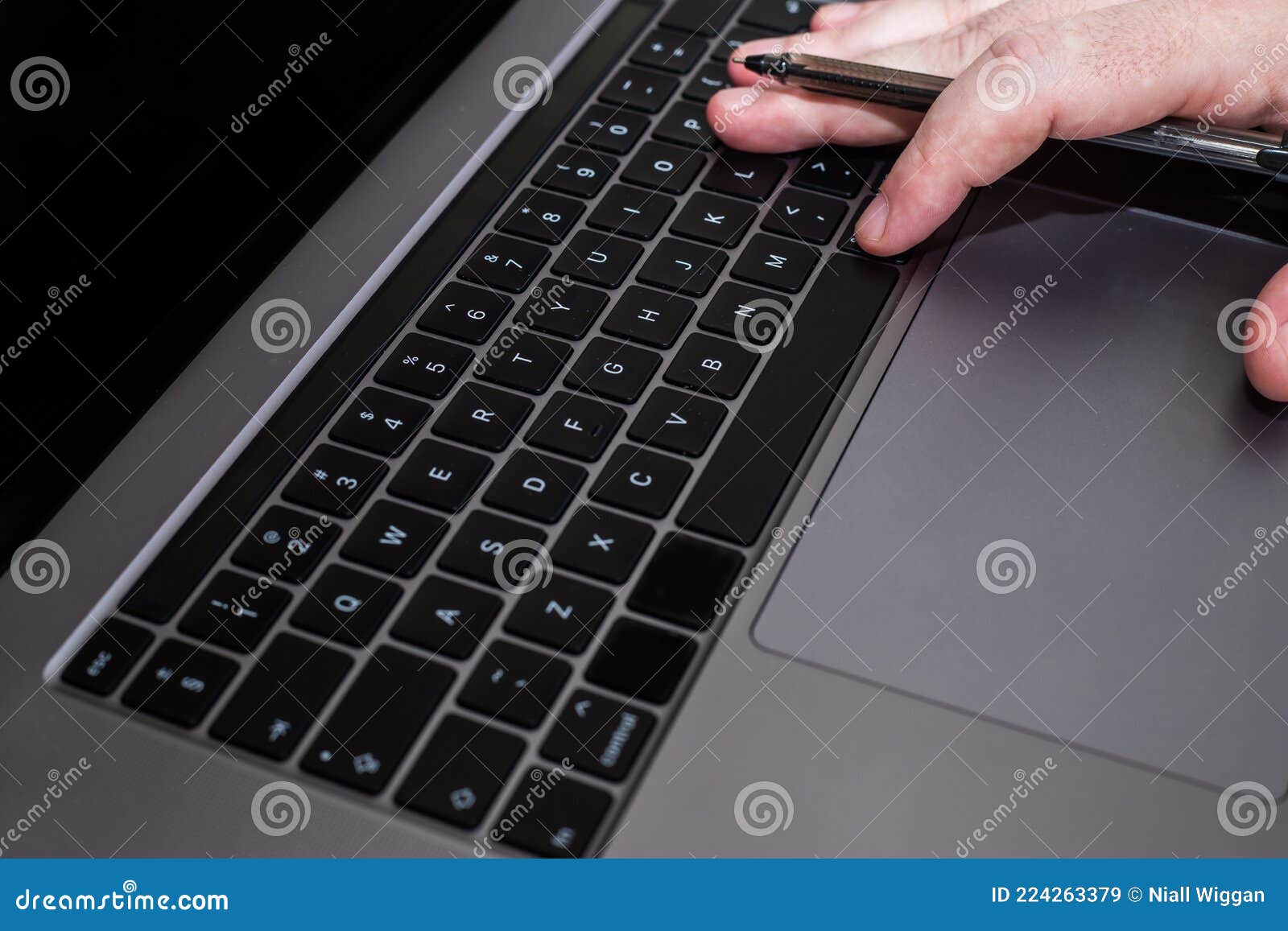 Hands Pressing Computer Keyboard Keys while Writing with Pencil in ...
