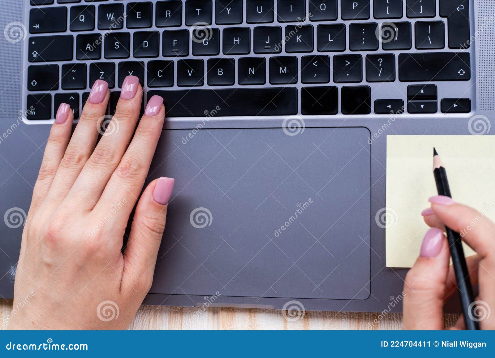 Hands Pressing Computer Keyboard Keys while Writing with Pencil in ...