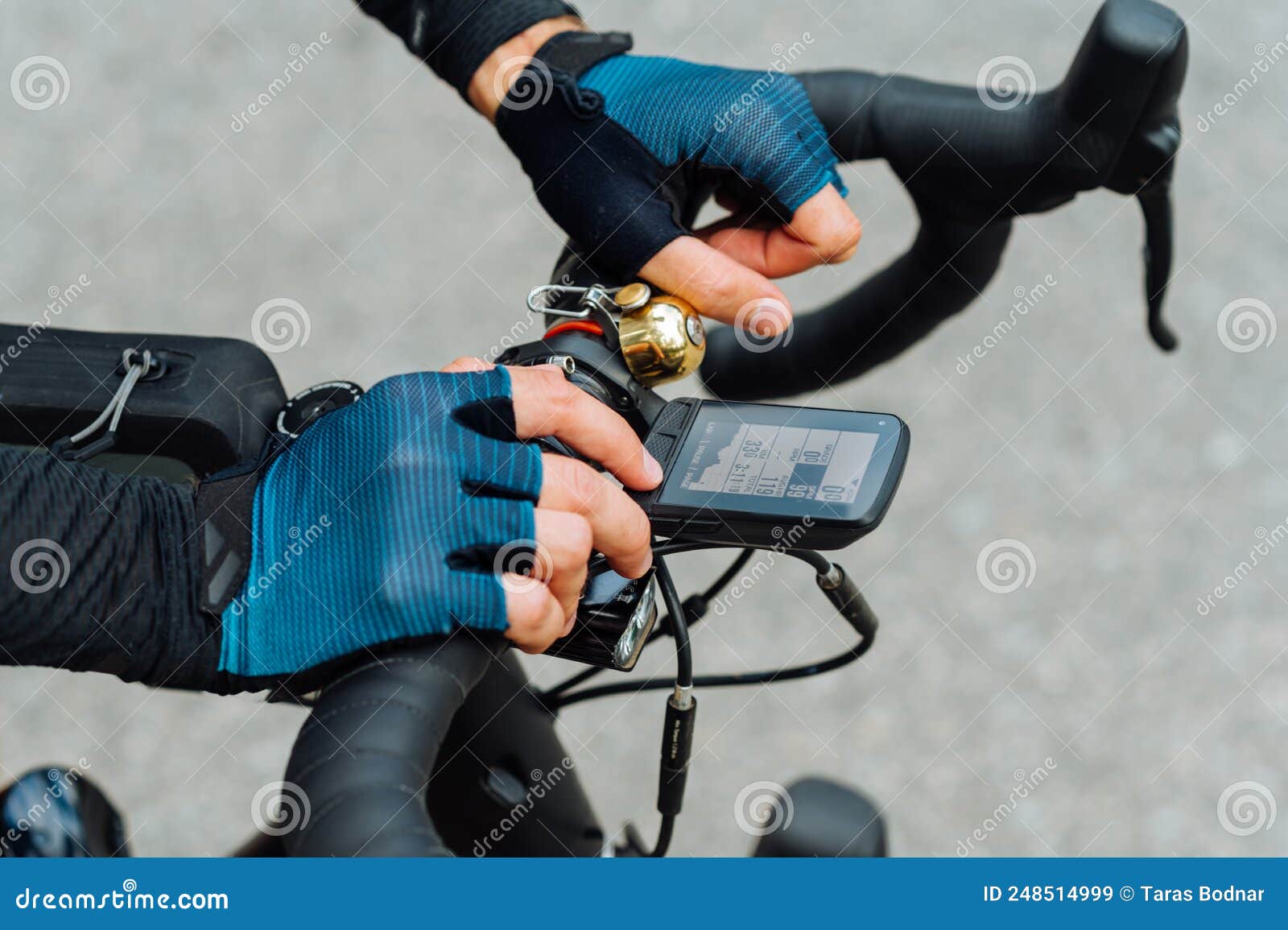 Hands of a Professional Cyclist on the Handlebars with a Bicycle ...