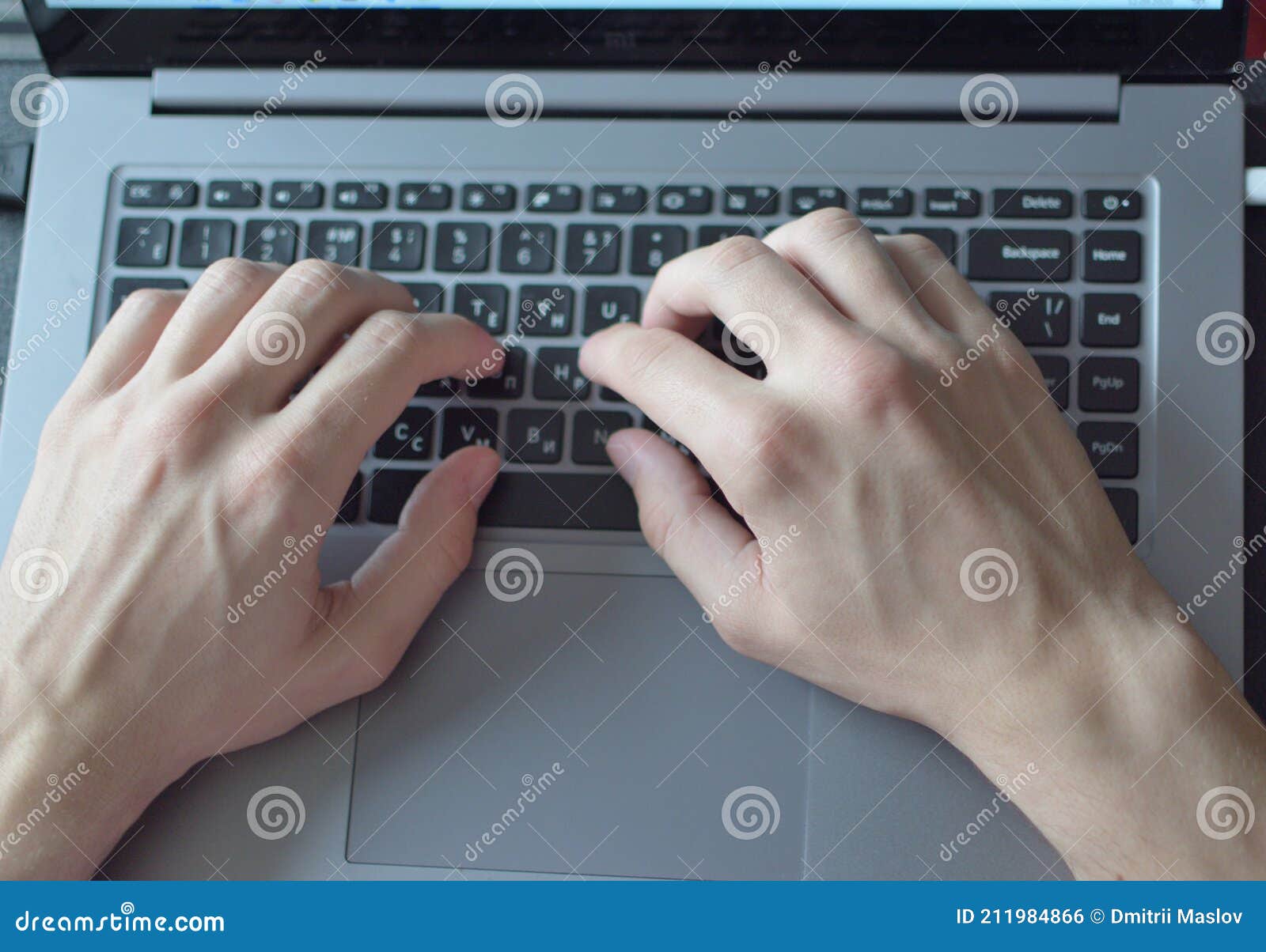 The Hands Of The Programmer Using A Keyboard, A Dark Background Stock ...