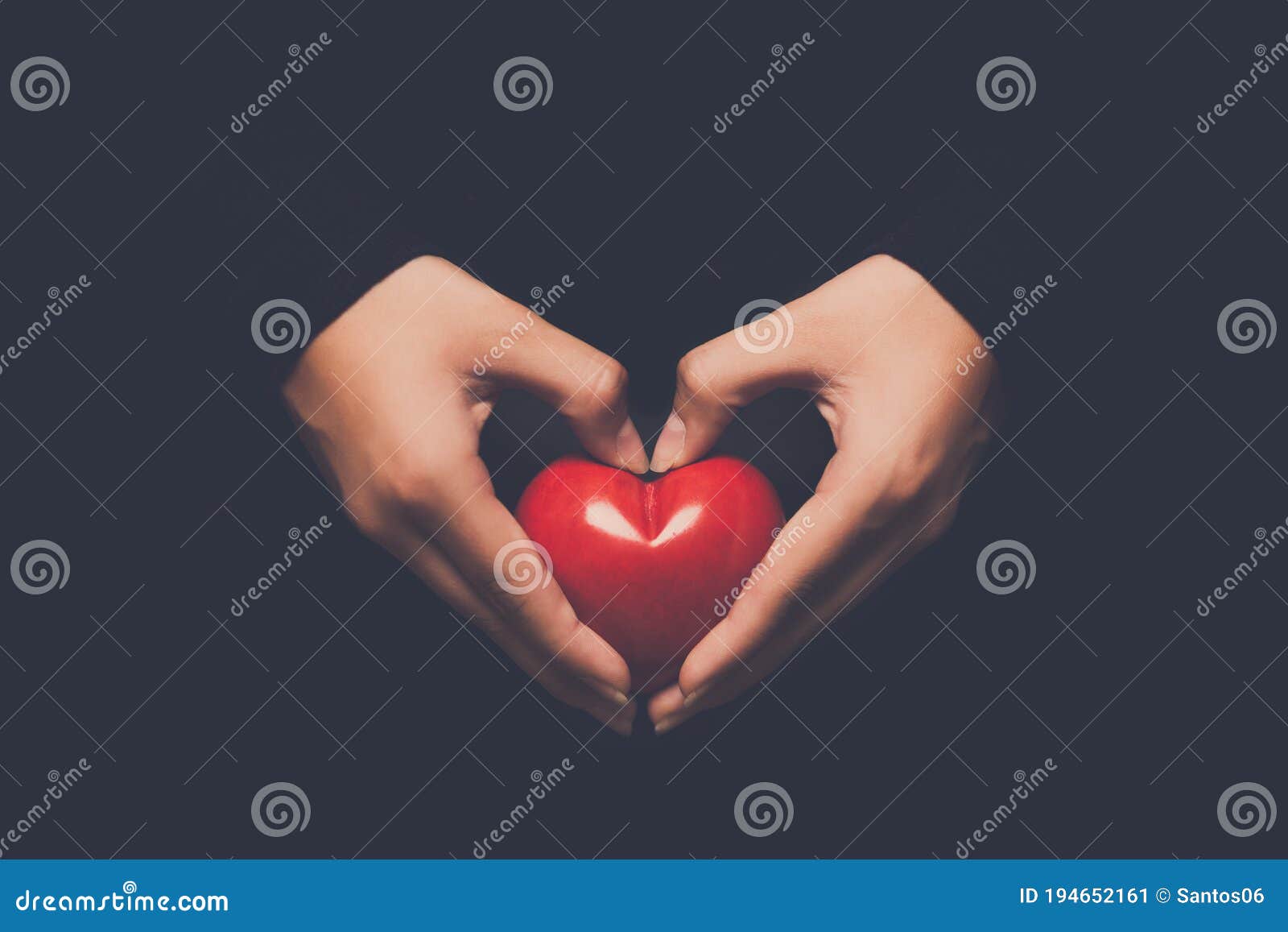 Hands protect a heart stock image. Image of concept - 194652161