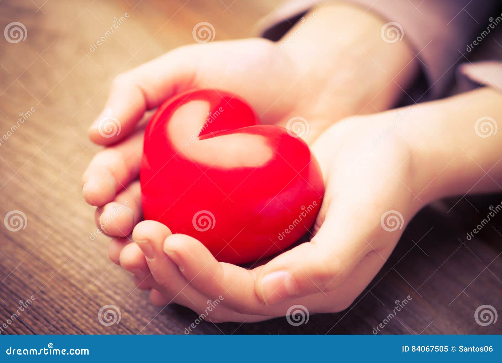 Hands protect a heart stock image. Image of background - 84067505