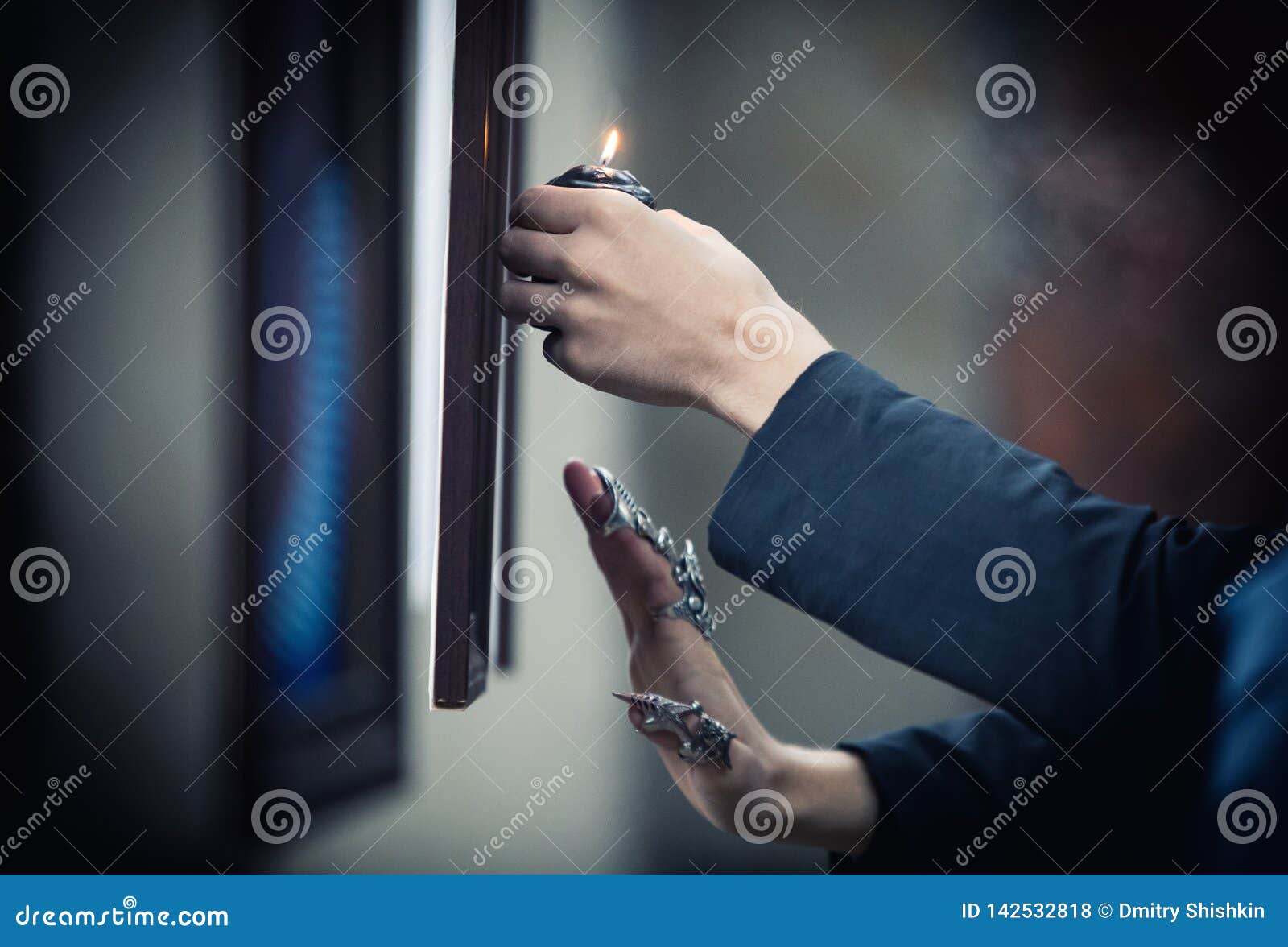 Hands of a Psychic with a Candle in the Process of Ritual Stock Photo ...