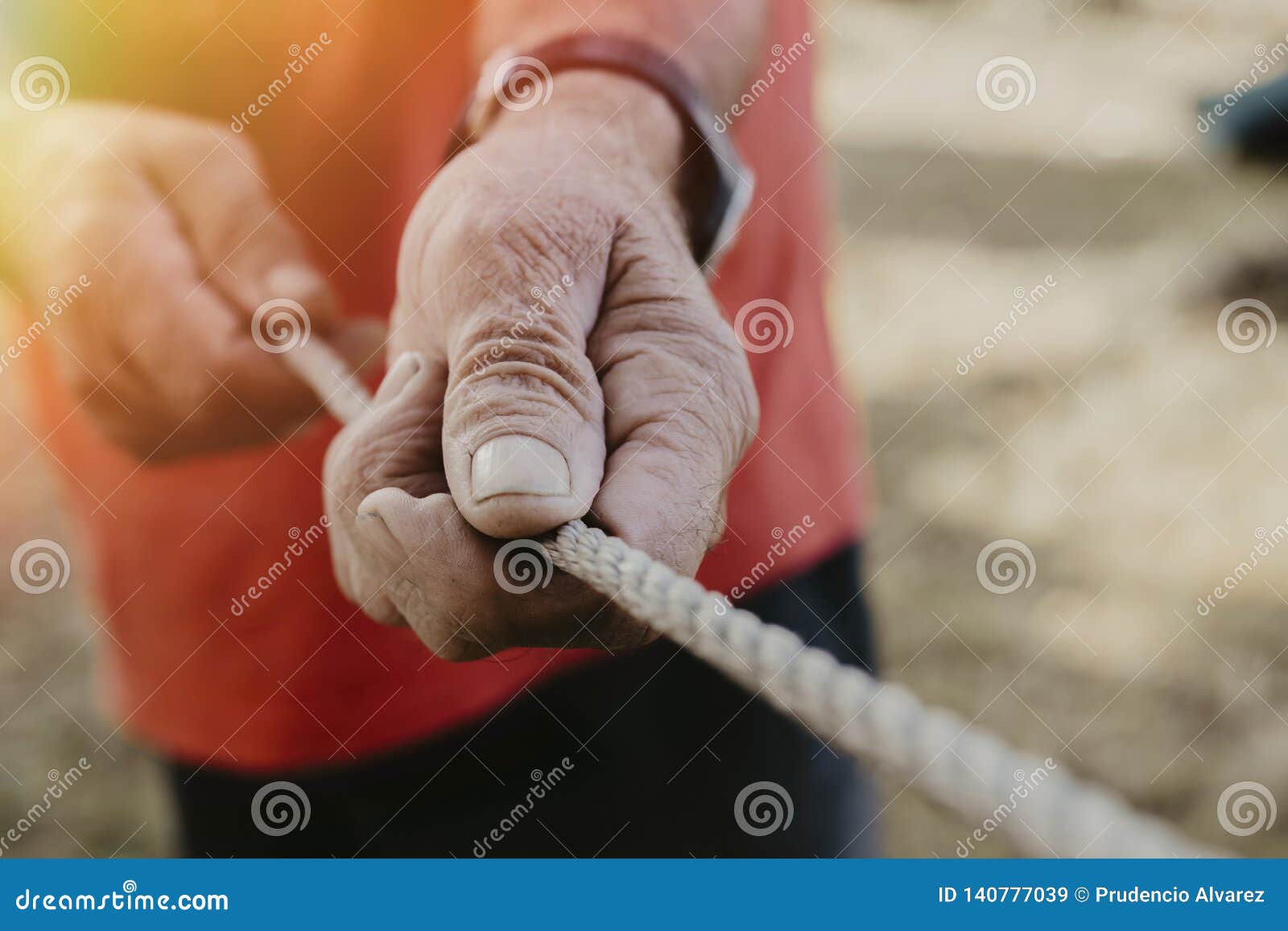 Hands pulling the rope stock image. Image of pensioner - 140777039