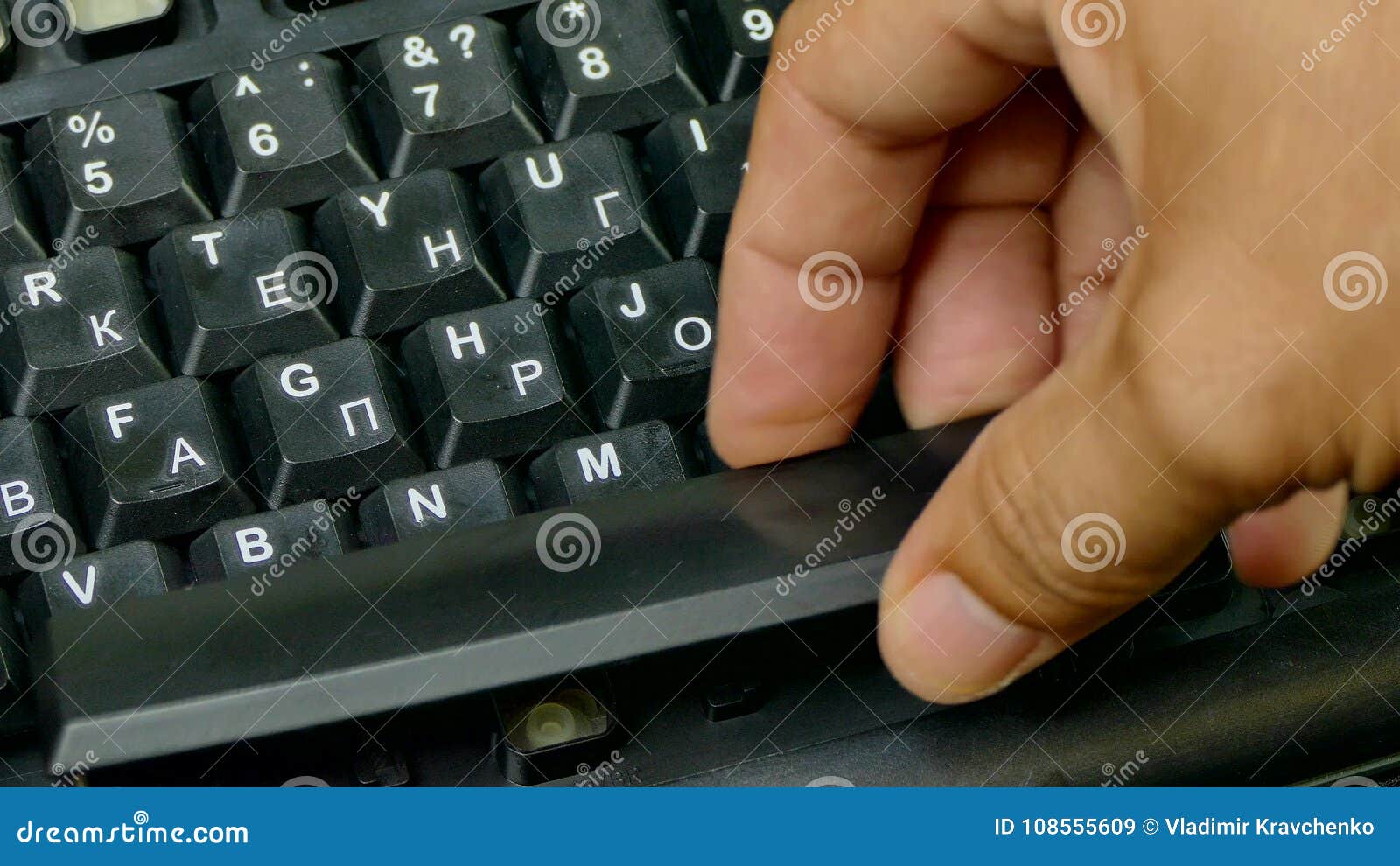 Hands Insert the Buttons of the Keyboard into the Groove on the Body ...