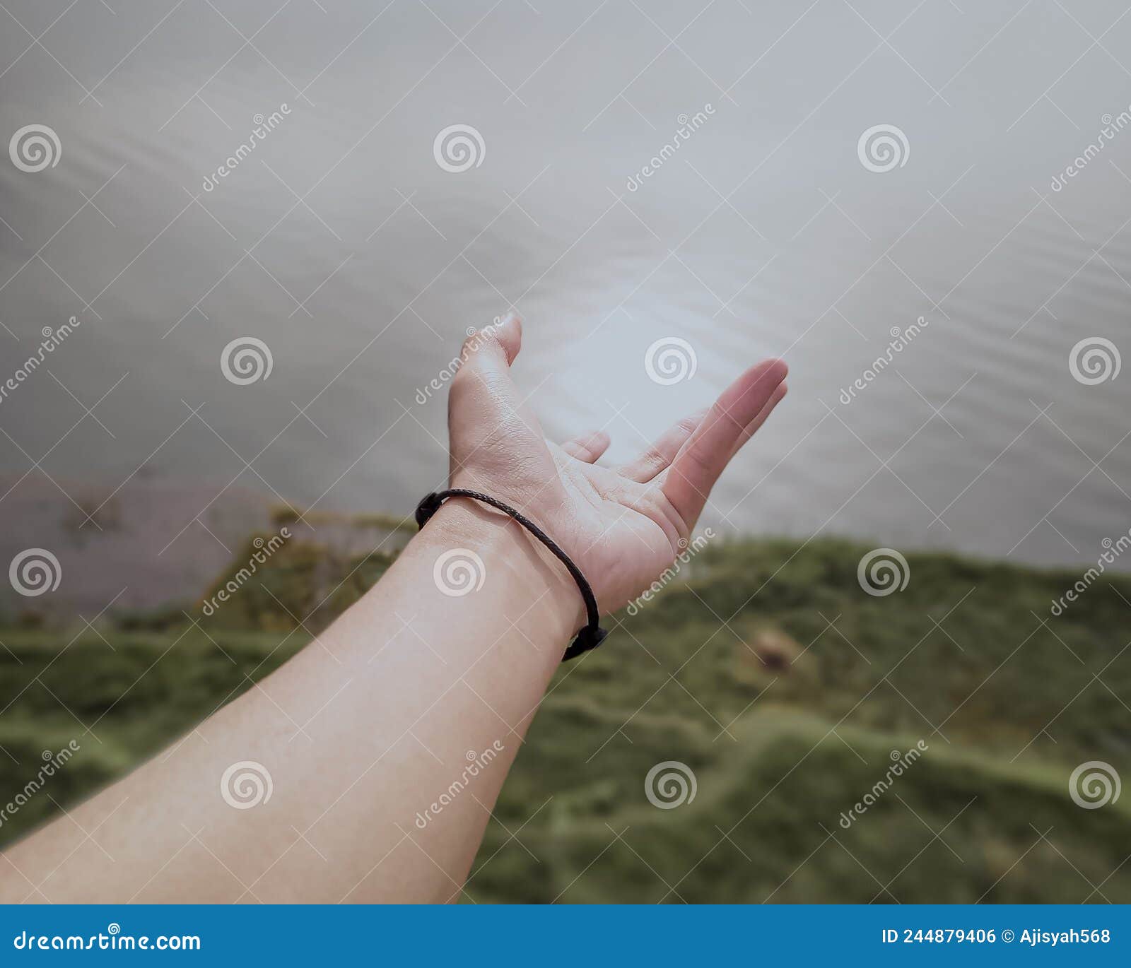Hands Reaching for the Reflection of Sunlight from the Lake Stock Photo ...