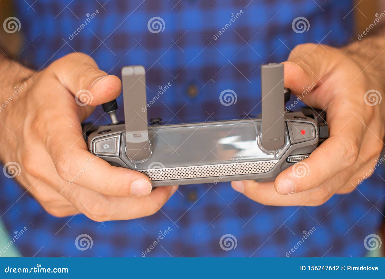 Hands with Remote Controller of Drone Outside. Man Using RC for Flying ...