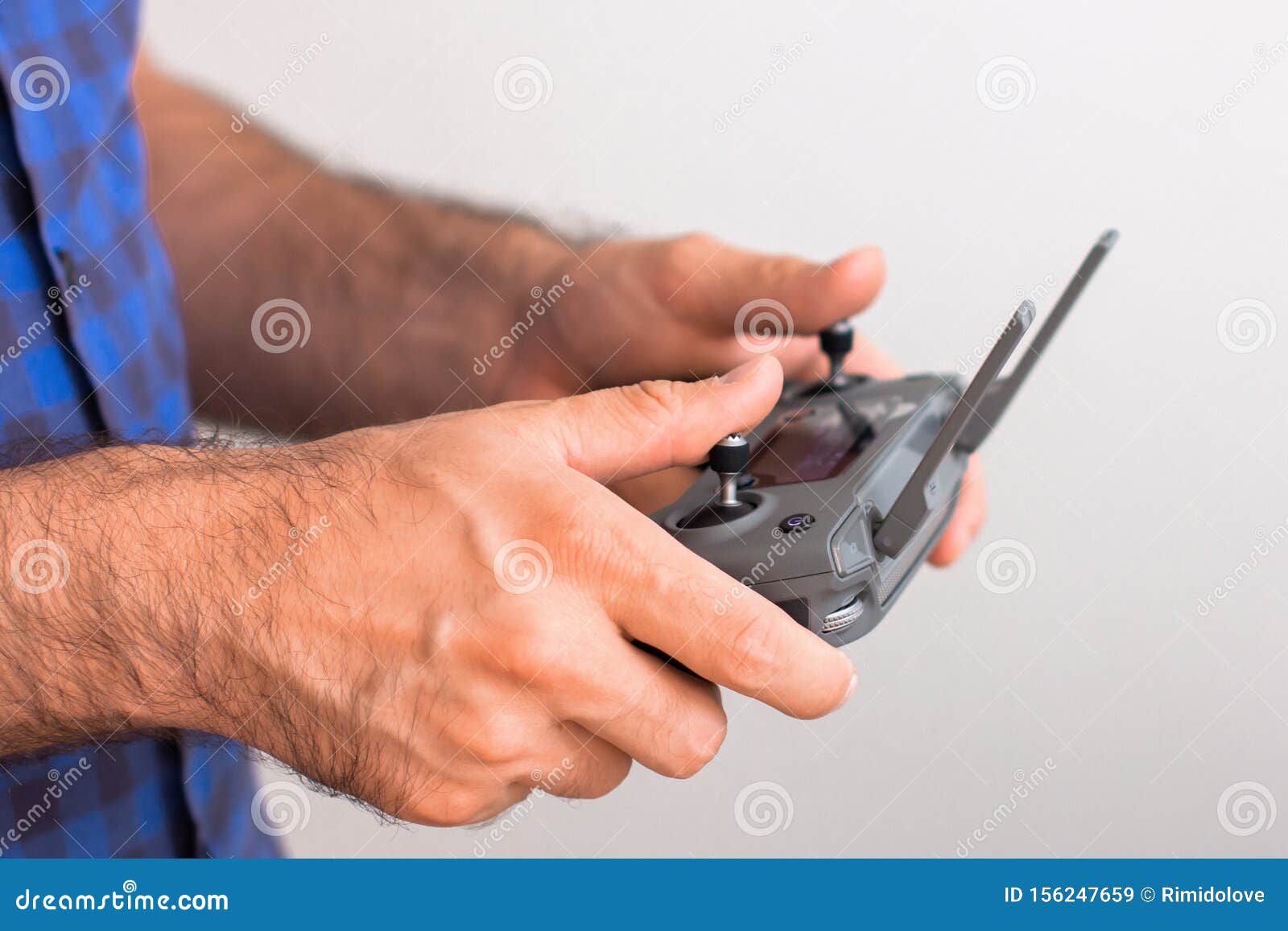 Hands with Remote Controller of Drone Outside. Man Using RC for Flying ...