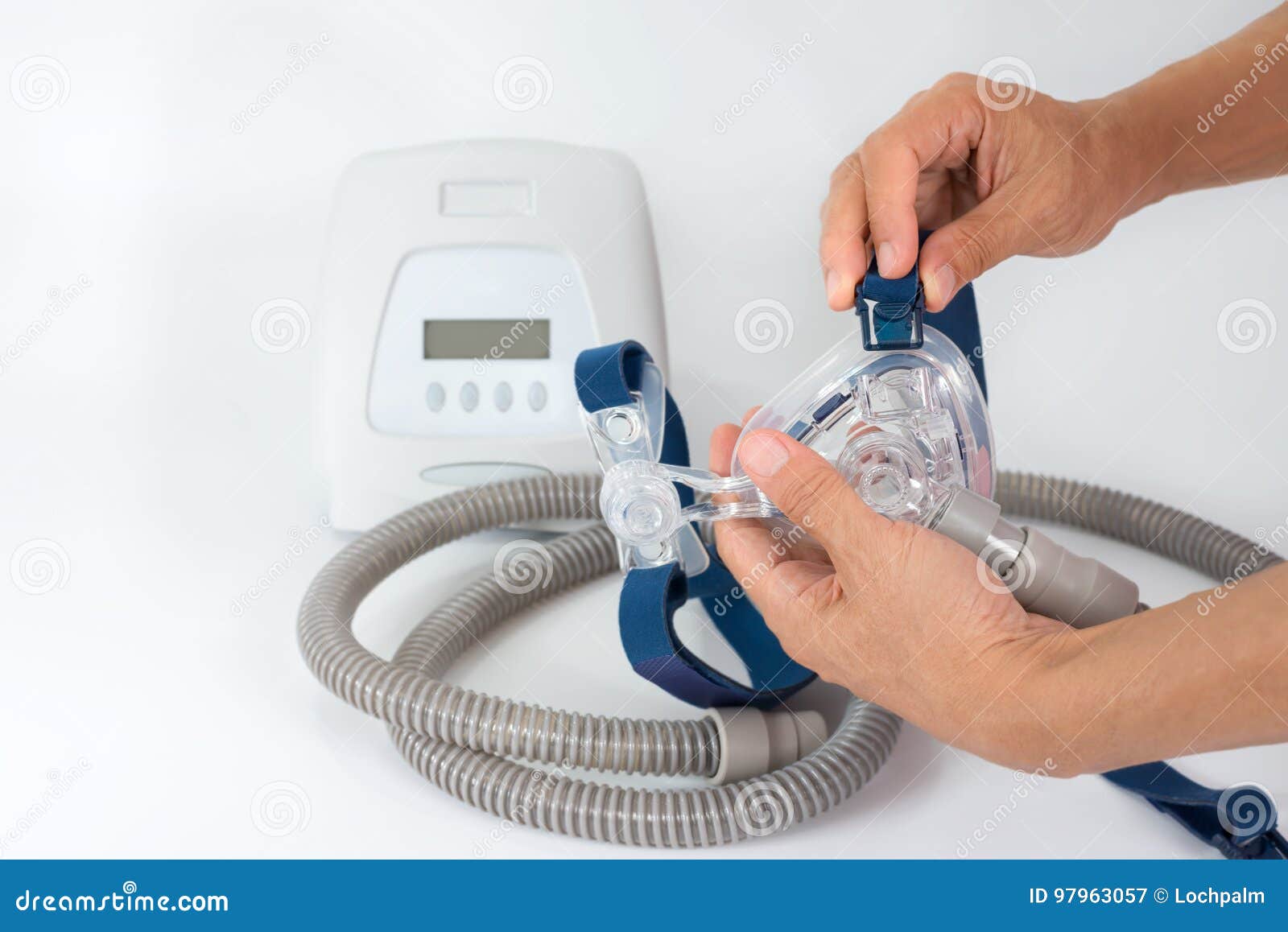 Hands Removing Clip from Headgear, Full Components of Cpap System ... Hands Removing Clip from Headgear, Full Components of Cpap System ...