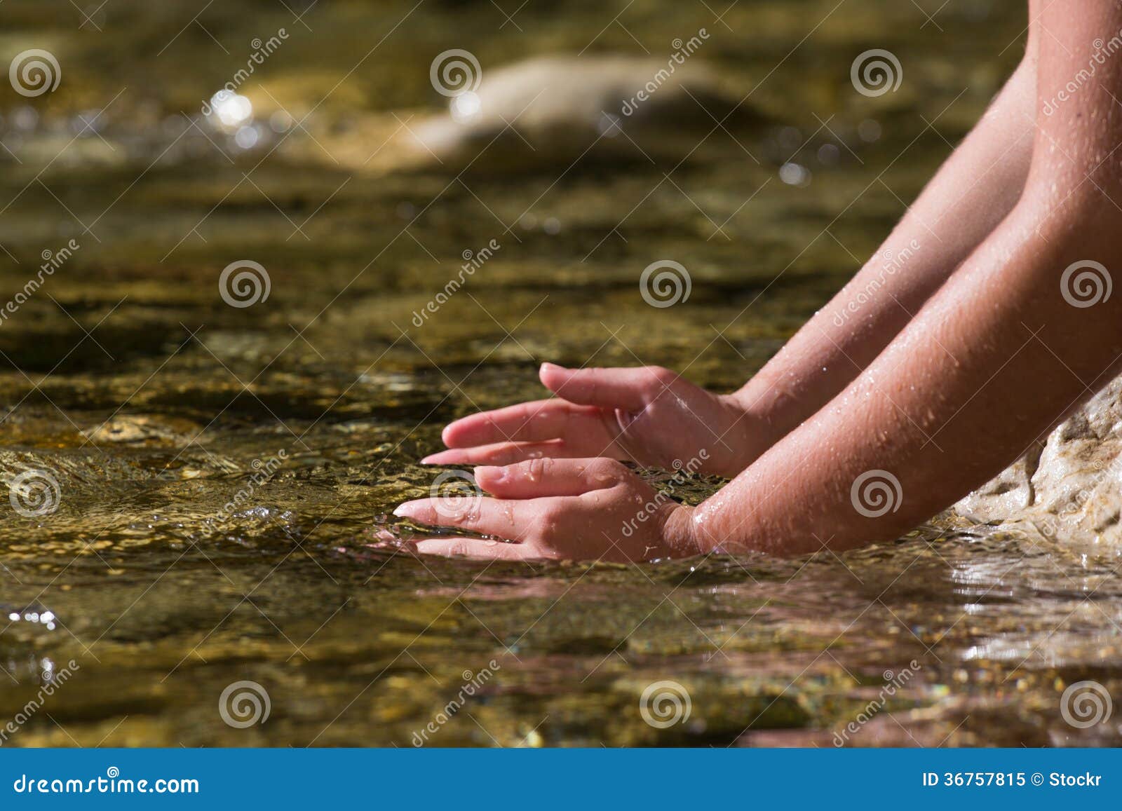 Hands in the river stock image. Image of people, pouring - 36757815