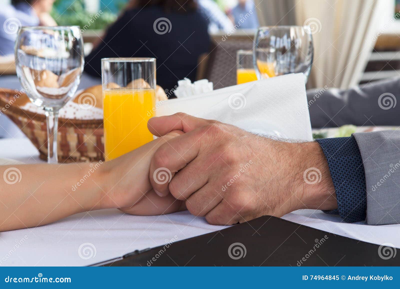 Hands of Romantic Couple Over a Restaurant Table Stock Image - Image of ...