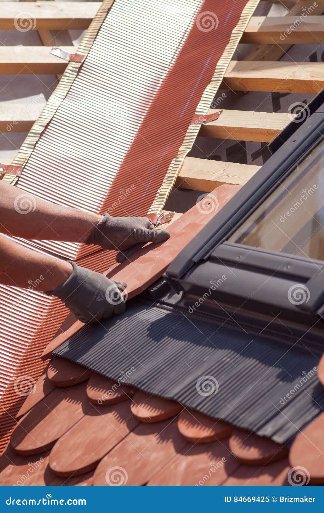 Hands Of Roofer Laying Tile On The Roof. Installing Natural Red Tile ...