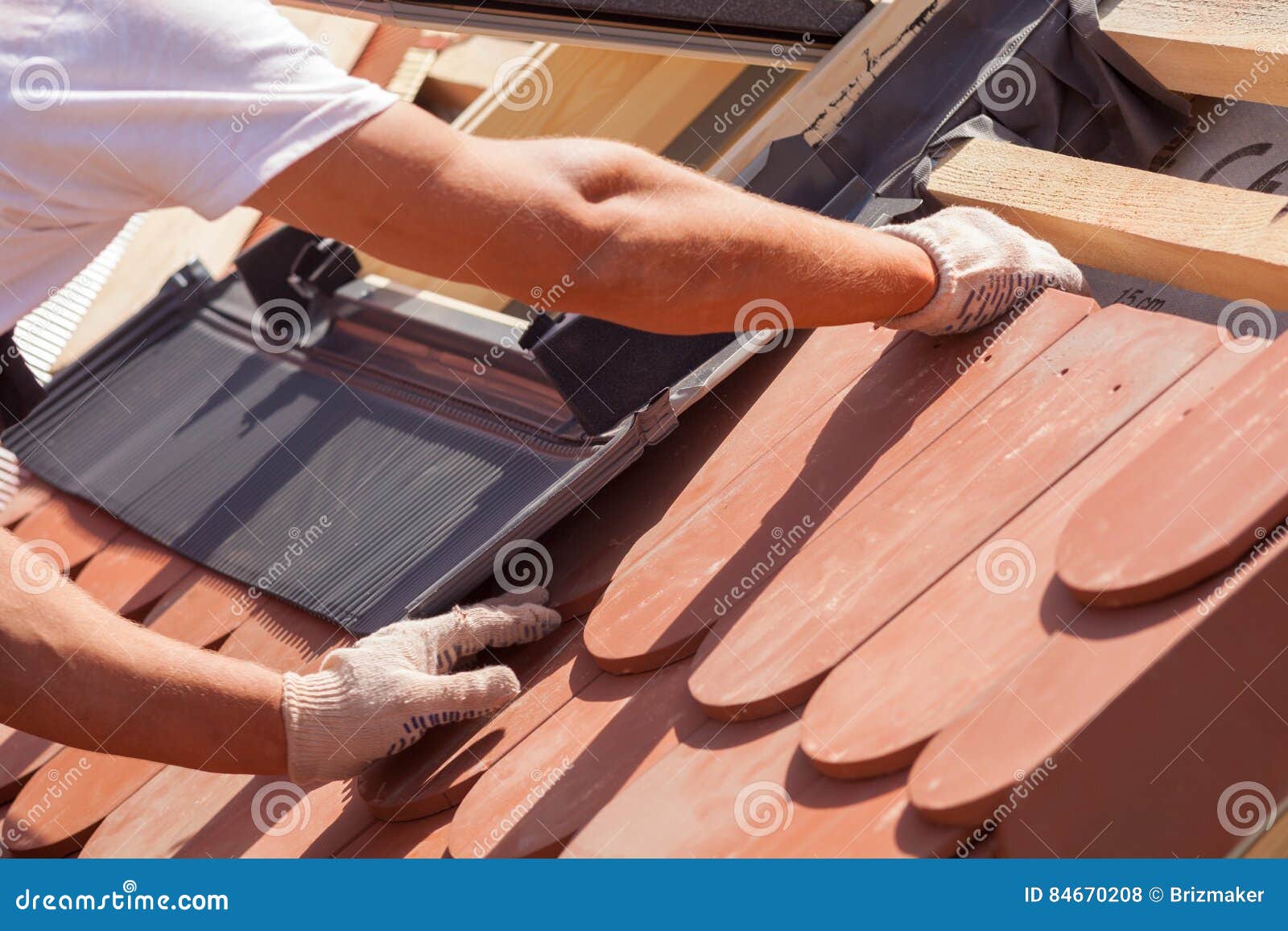 Hands Of Roofer Laying Tile On The Roof. Installing Natural Red Tile ...