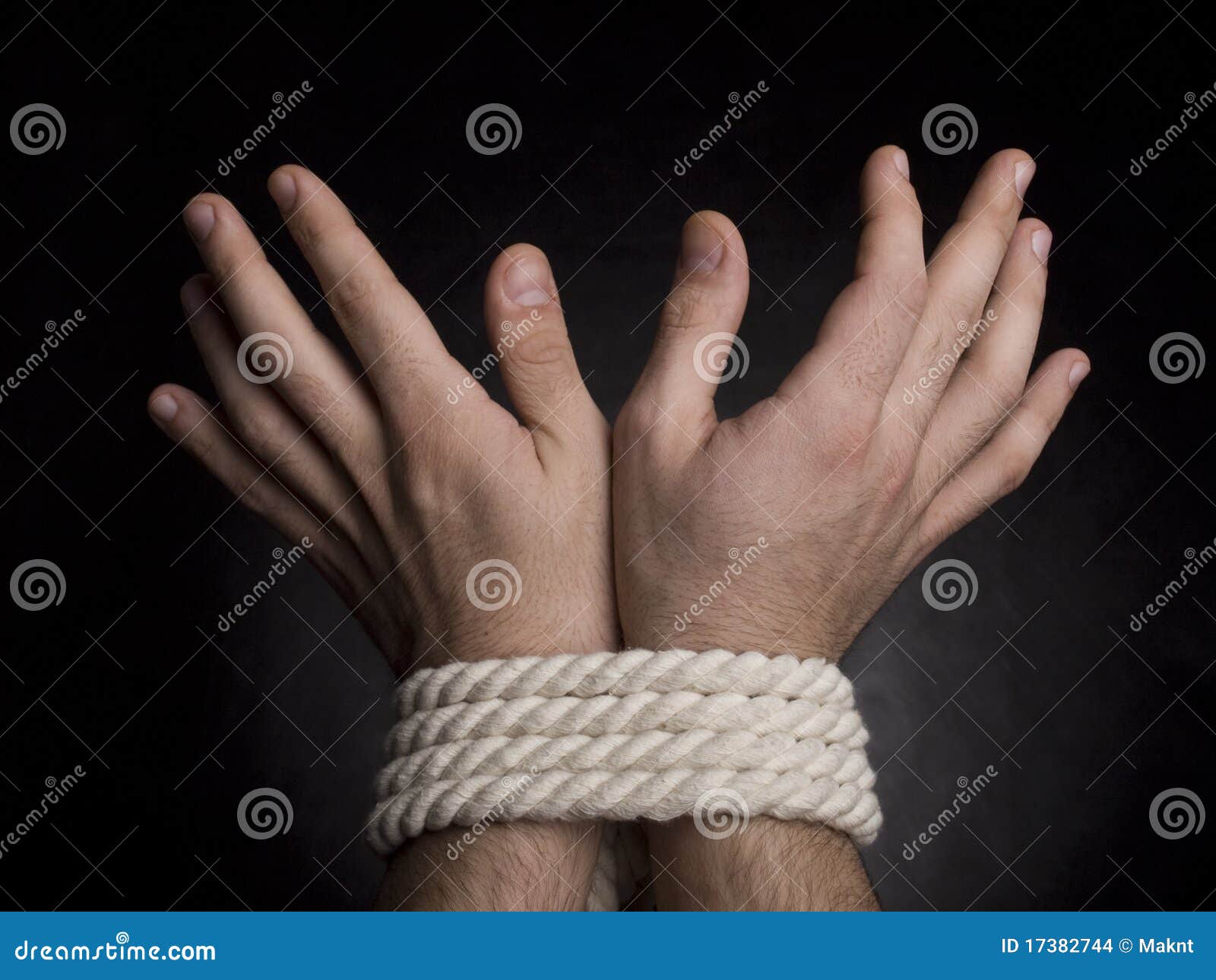Hands with a rope stock photo. Image of finger, harassment - 17382744