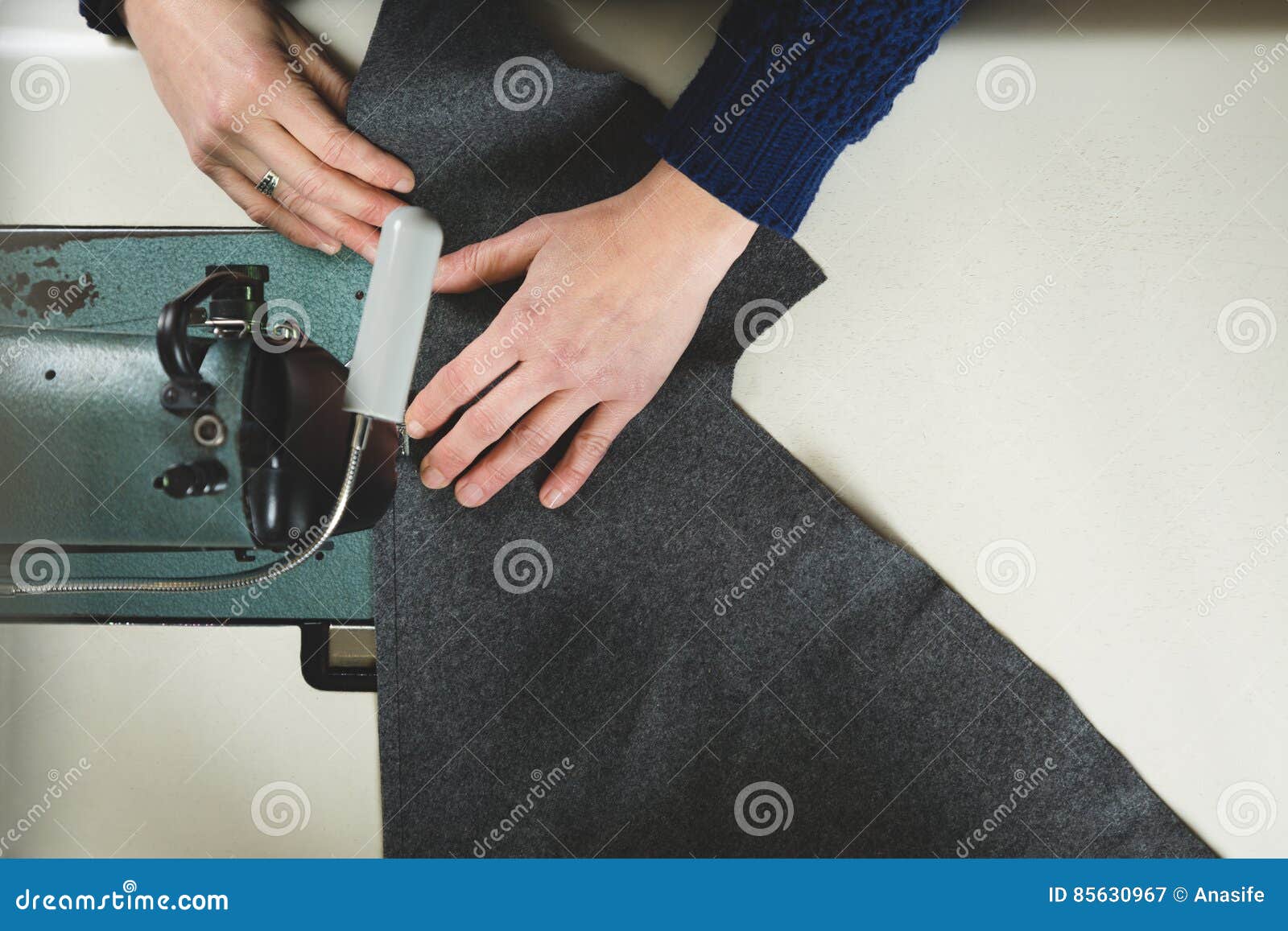 Hands of Seamstress Sewing with a Professional Machine Stock Image ...