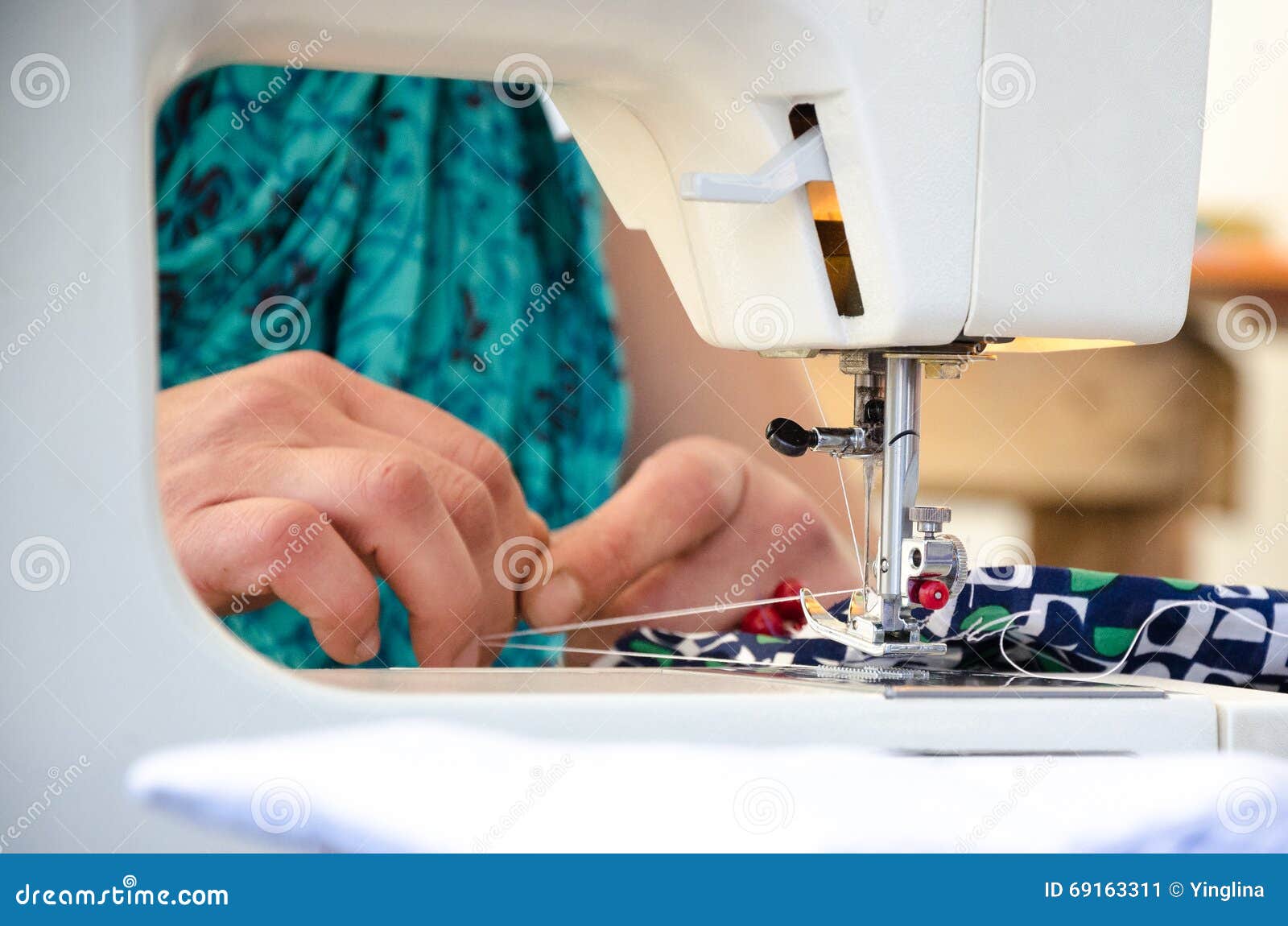 Hands sewing in a machine stock image. Image of manufacturing - 69163311