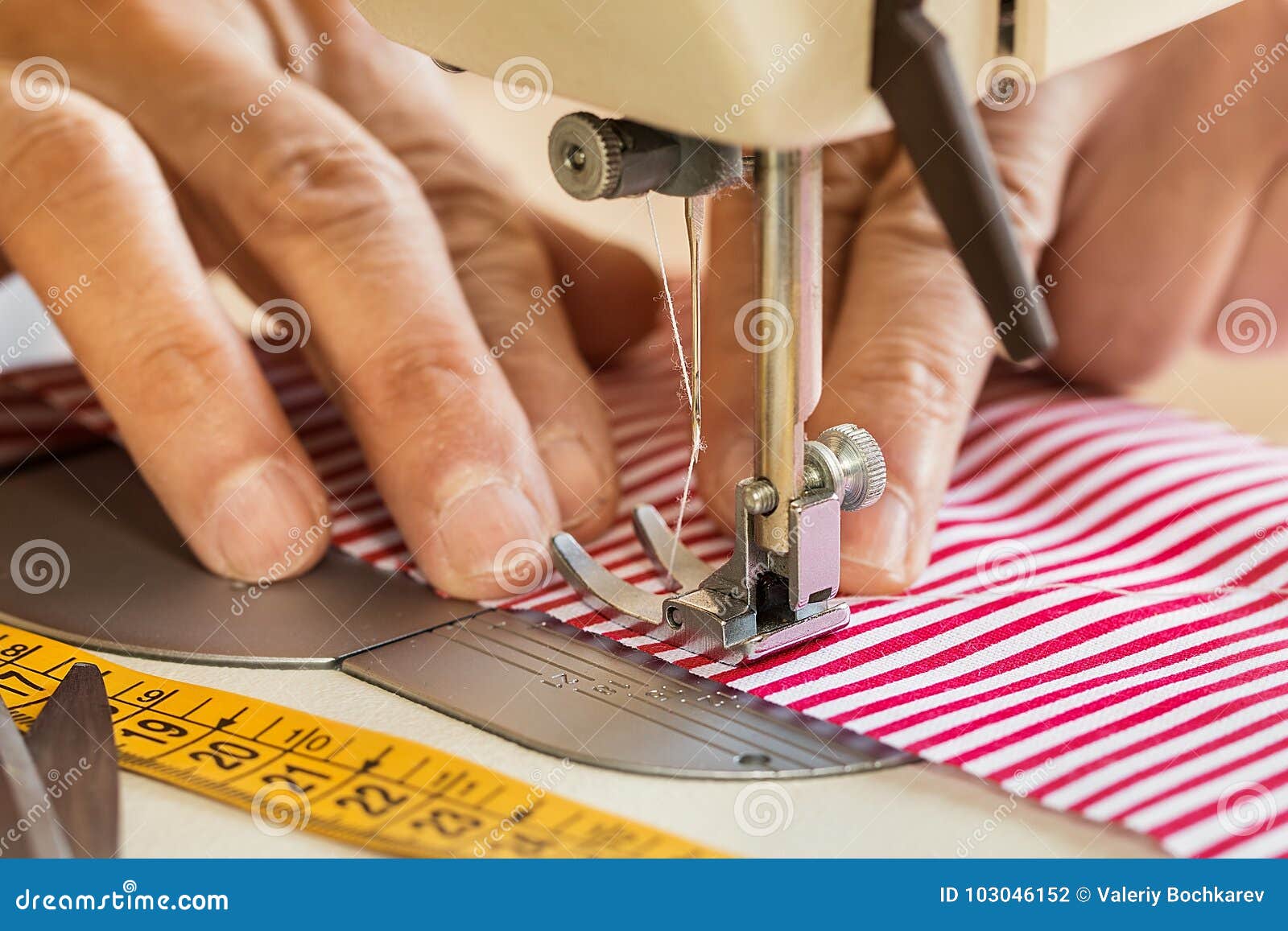 Hands at Sewing Machine Holding Some Fabric Stock Photo - Image of hand ...