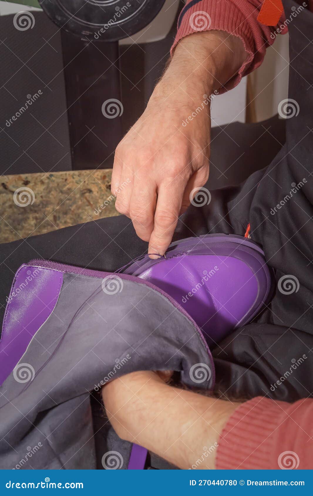 Hands of the Shoemaker with the Help of an Awl and the Thread Sew the ...