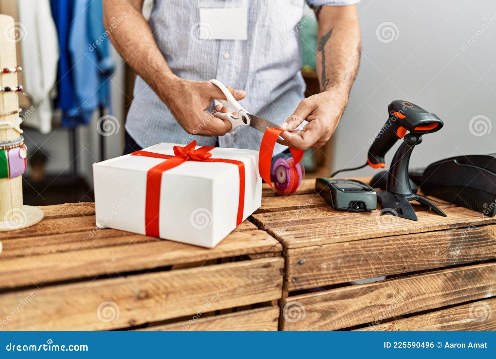 Hands of Shopkeeper Man Preparing Gift at Clothing Store Stock Photo ...