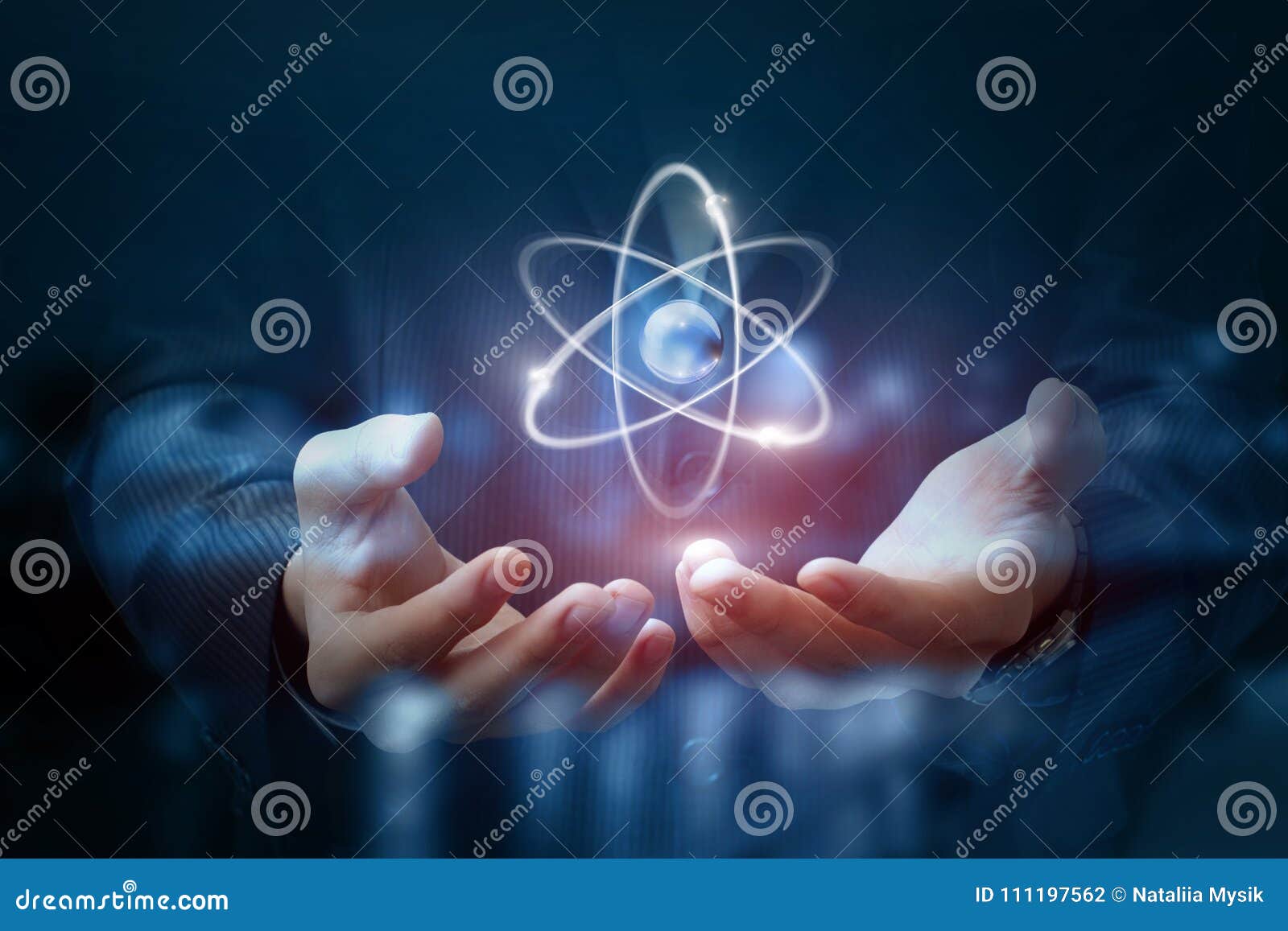 Hands shows the atom . stock photo. Image of chemistry - 111197562