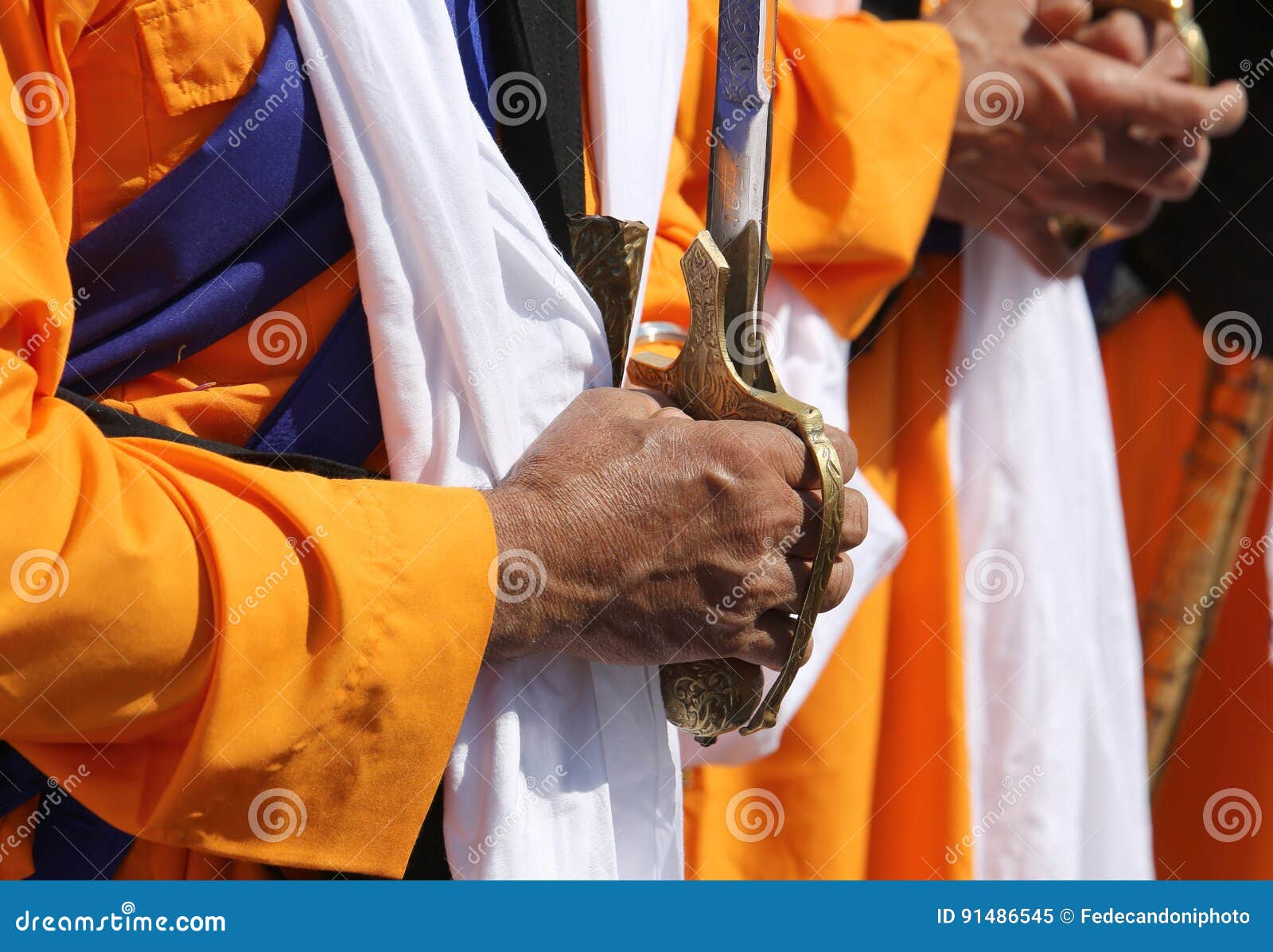 Hands of a Sikh Elder Man Who Hold the Sword during Religious Fu Stock ...