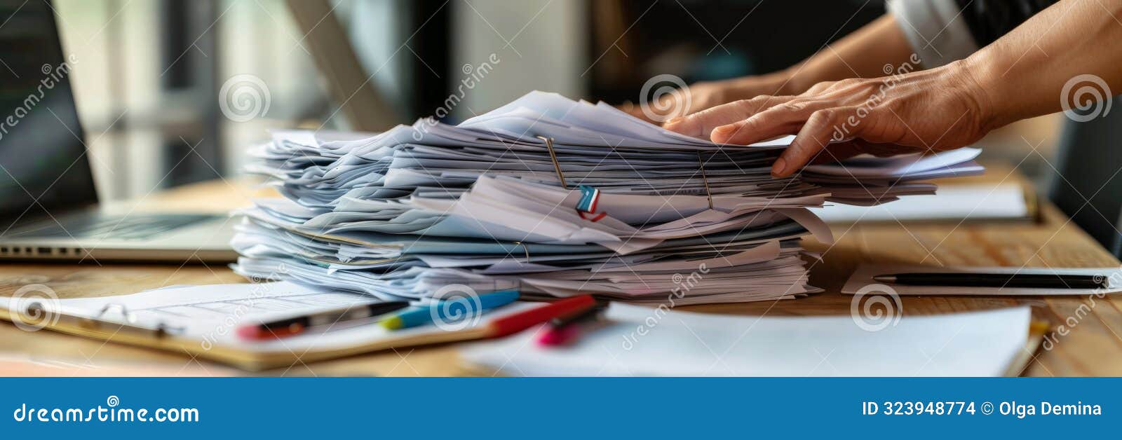 Hands Sorting through Piles of Paperwork in a Busy Office. Business ...