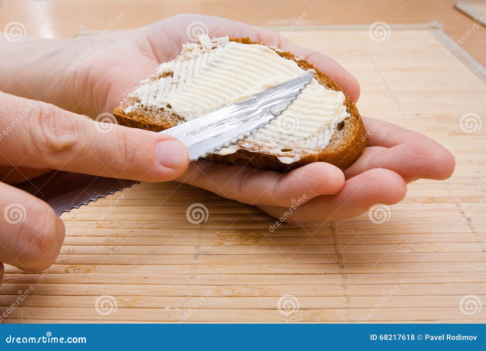 Hands Spreading Butter on Piece of Rye Bread Stock Photo - Image of ...