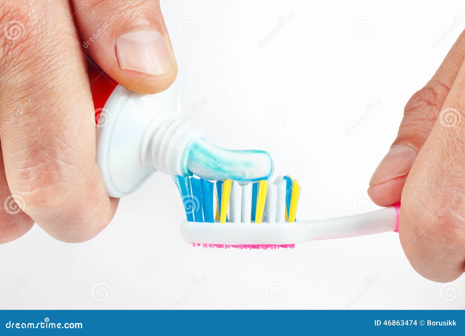 Hands Squeezing Color Toothpaste from a Tube on Toothbrush Stock Photo ...